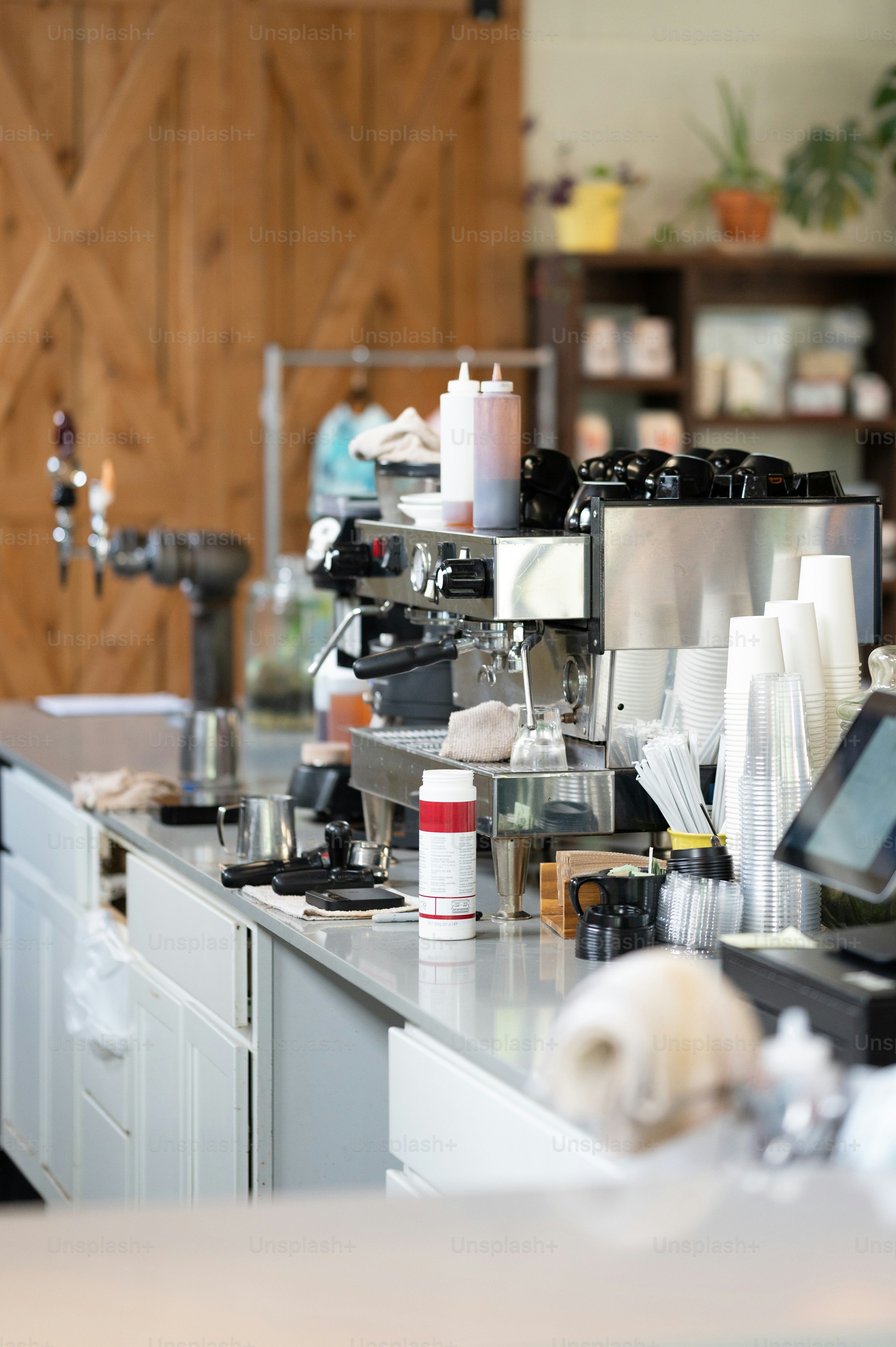 A kitchen with a counter top covered in lots of clutter photo – Coffee ...