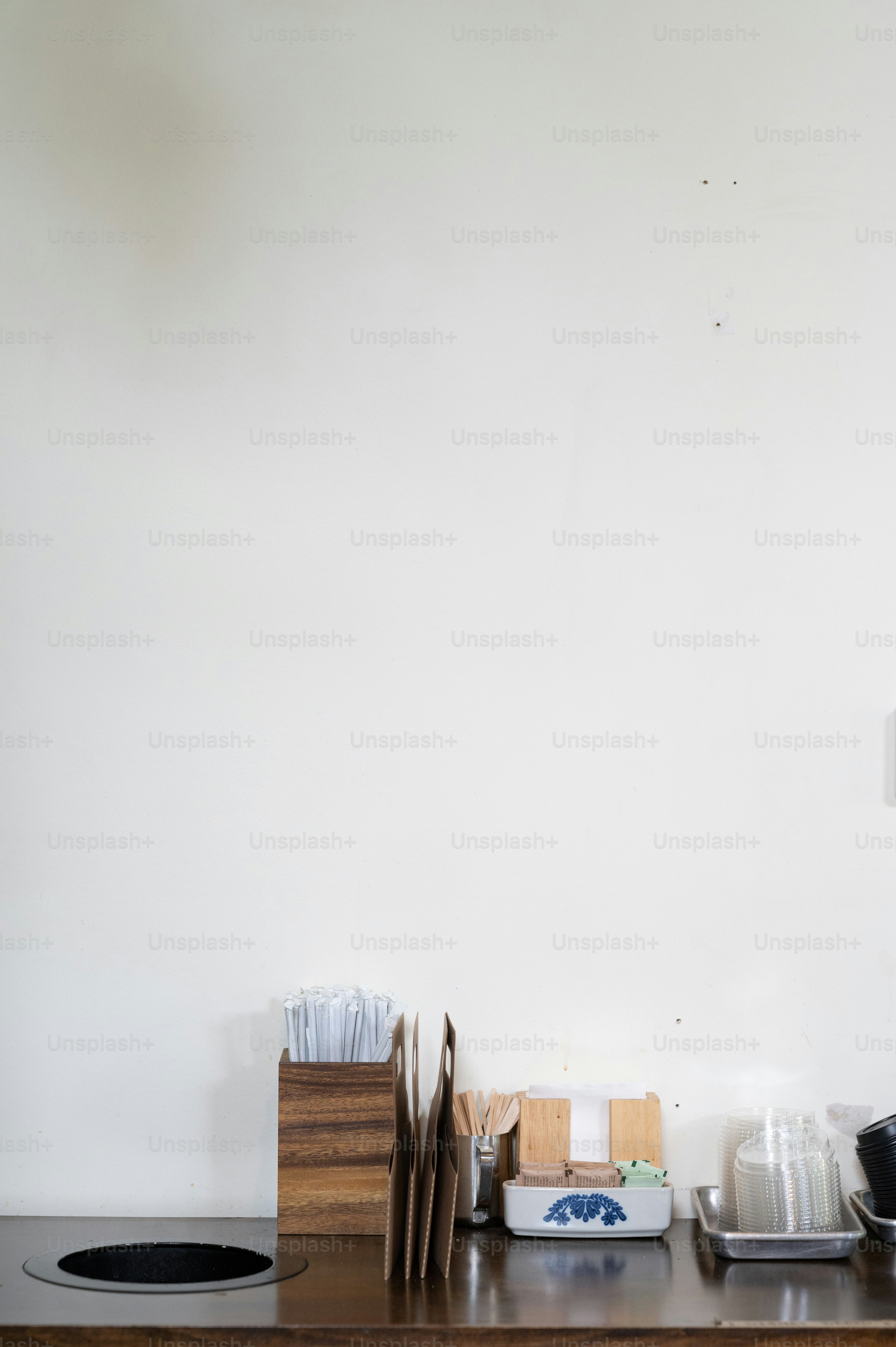 A kitchen counter with a toaster, toaster, and other items on it photo ...