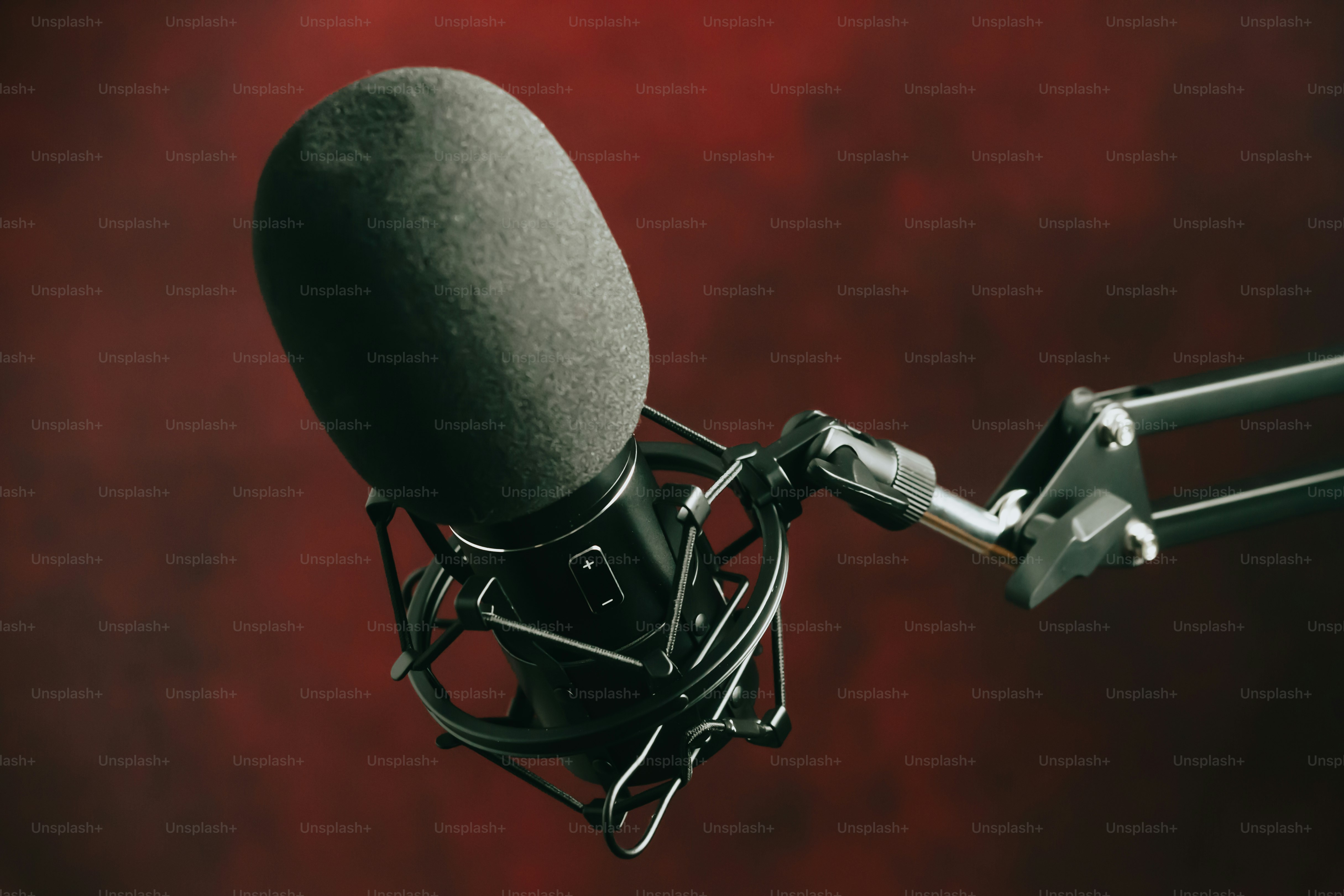 A close up of a microphone with a red background photo – Microphone ...