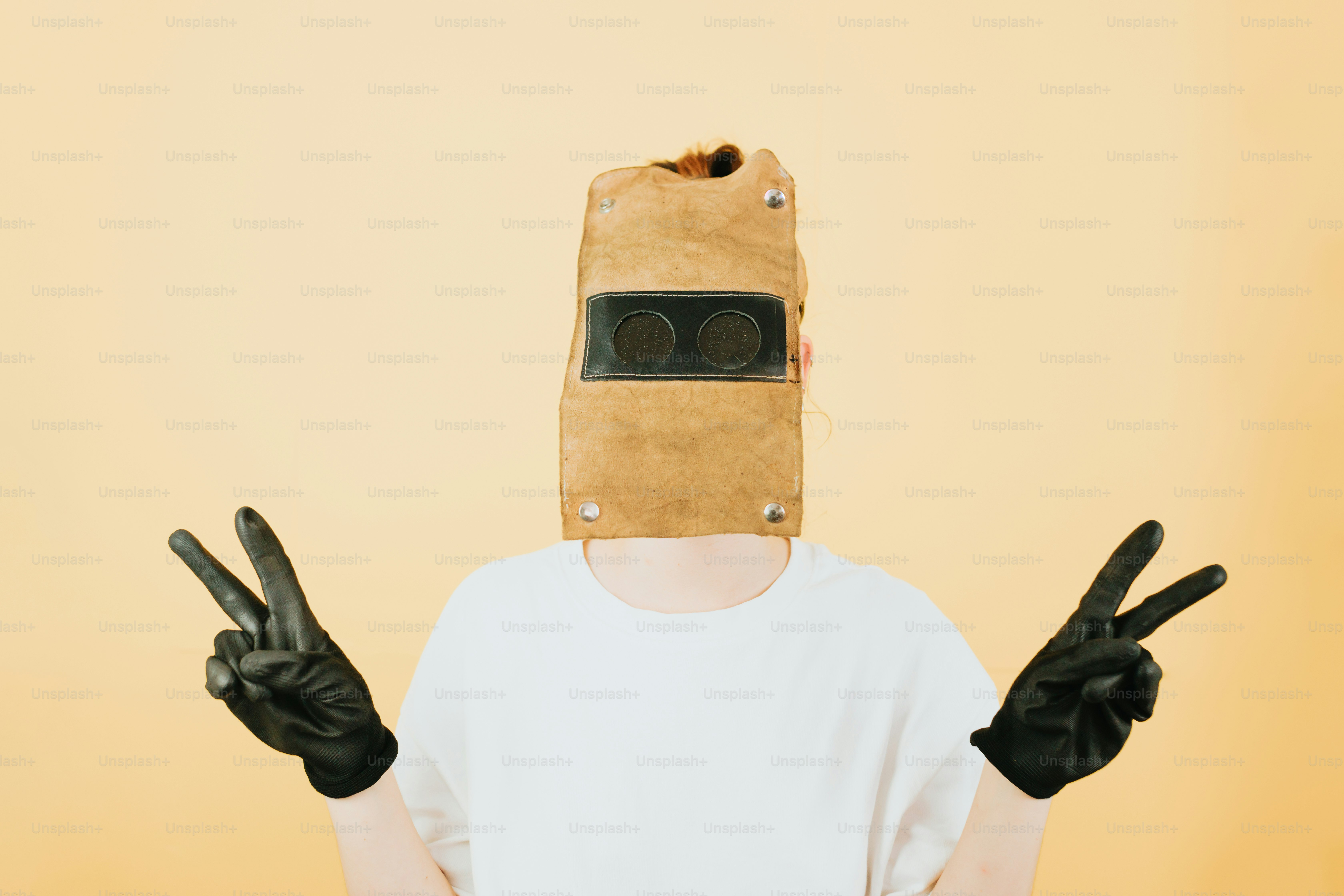 A person wearing a paper bag over their head photo – Protective ...