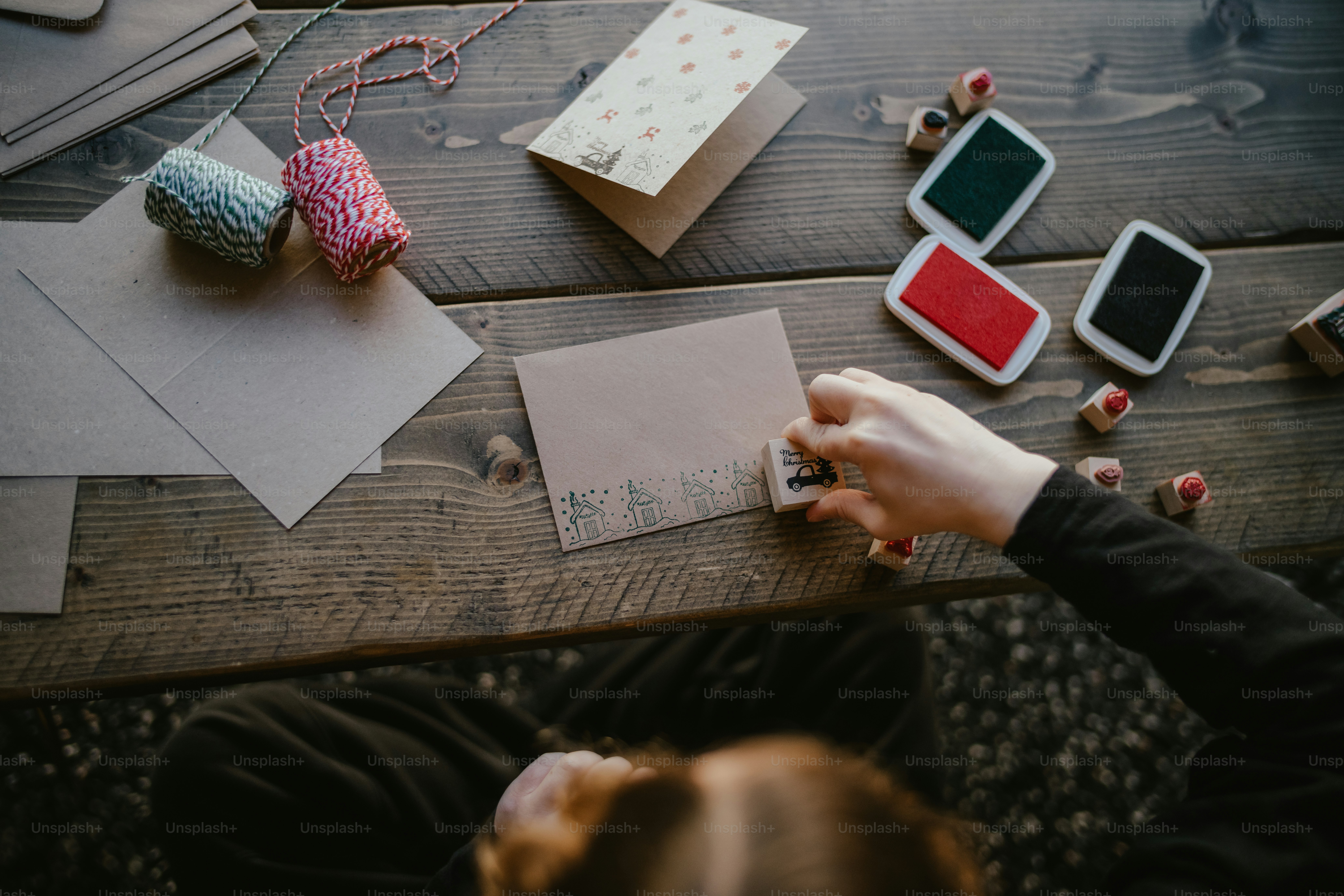 A person writing on a piece of paper photo – Christmas presents Image ...