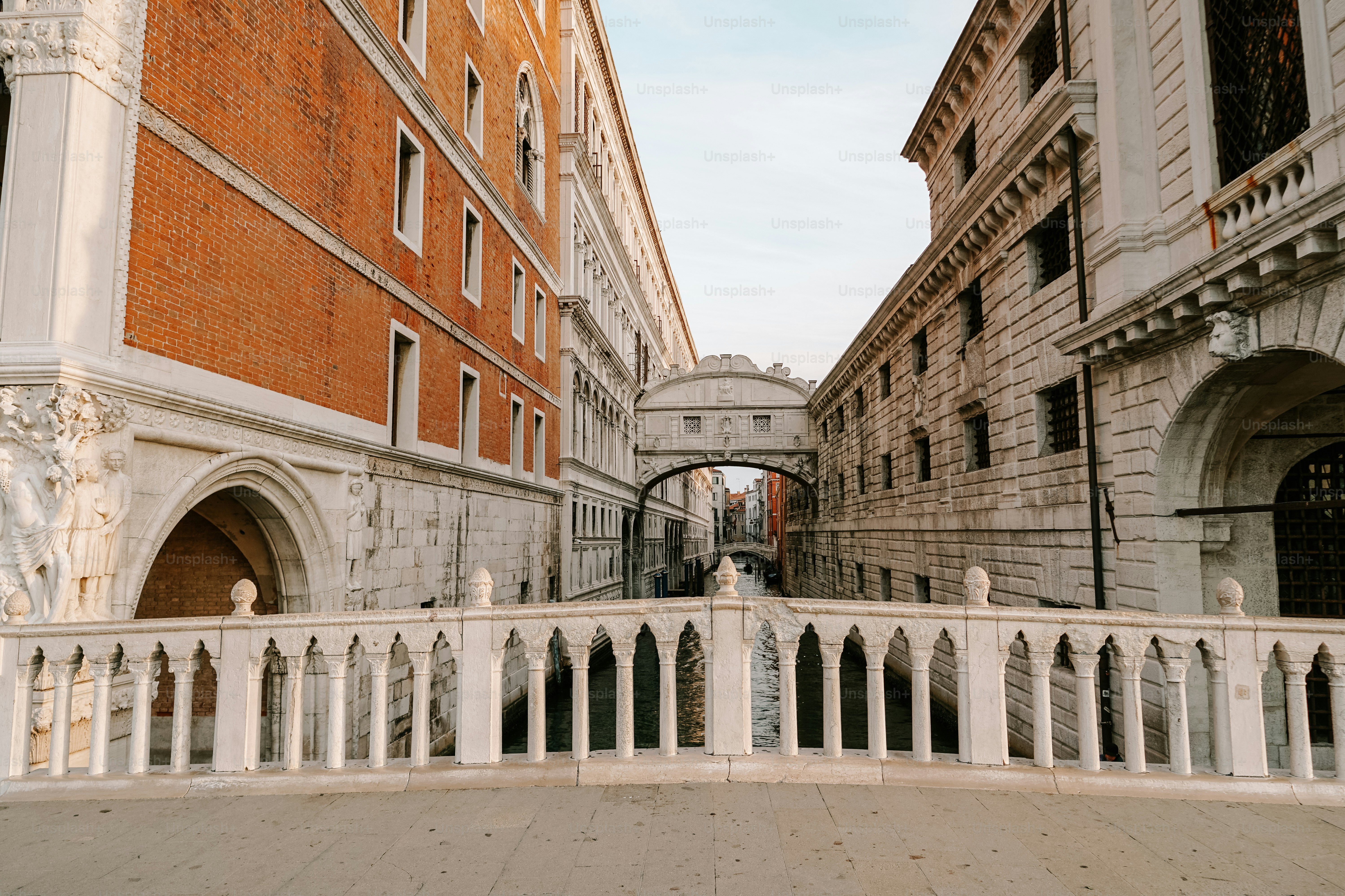A walkway between two buildings in a city photo – Historic Image on ...