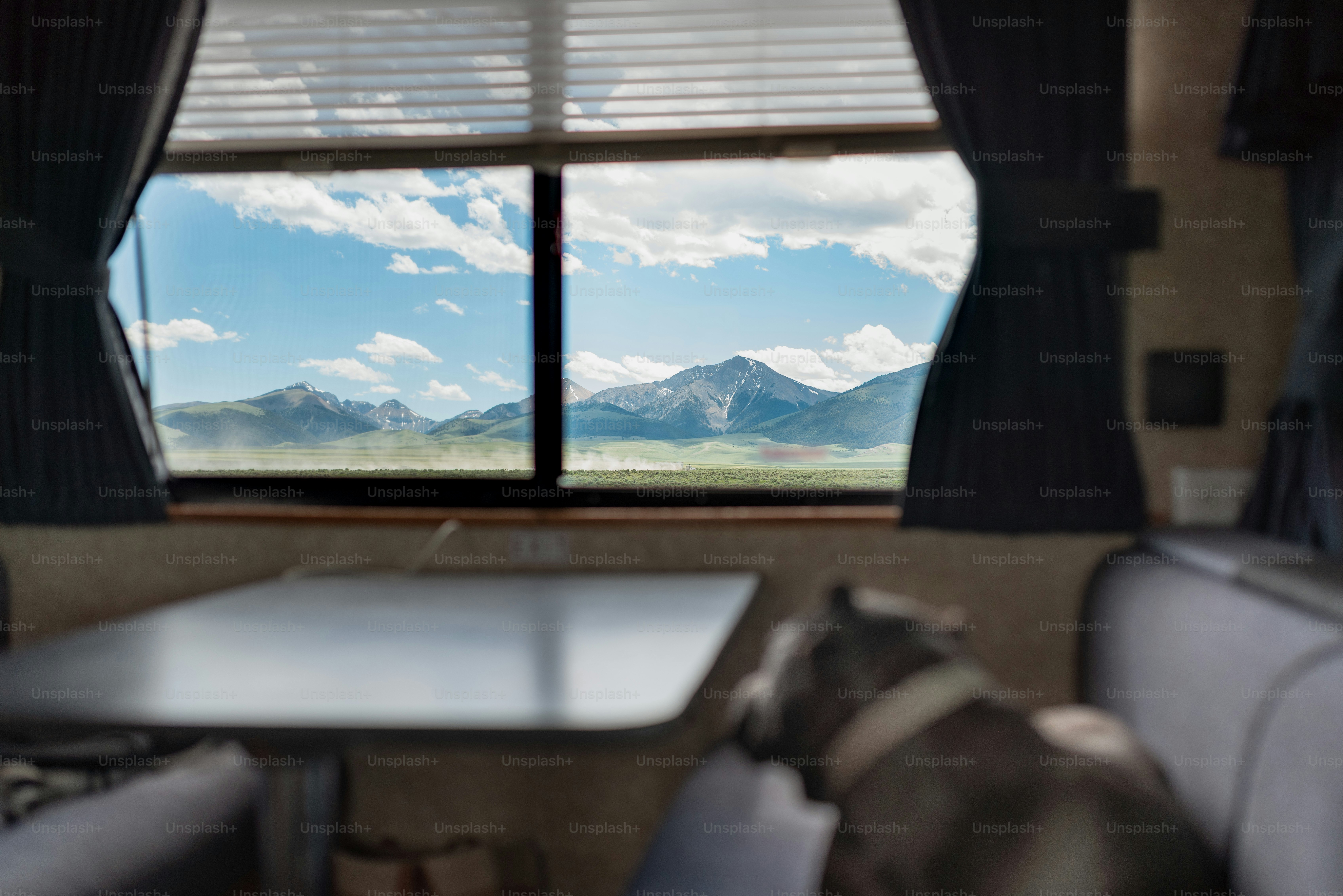 A view of mountains out a window of a recreational vehicle photo ...