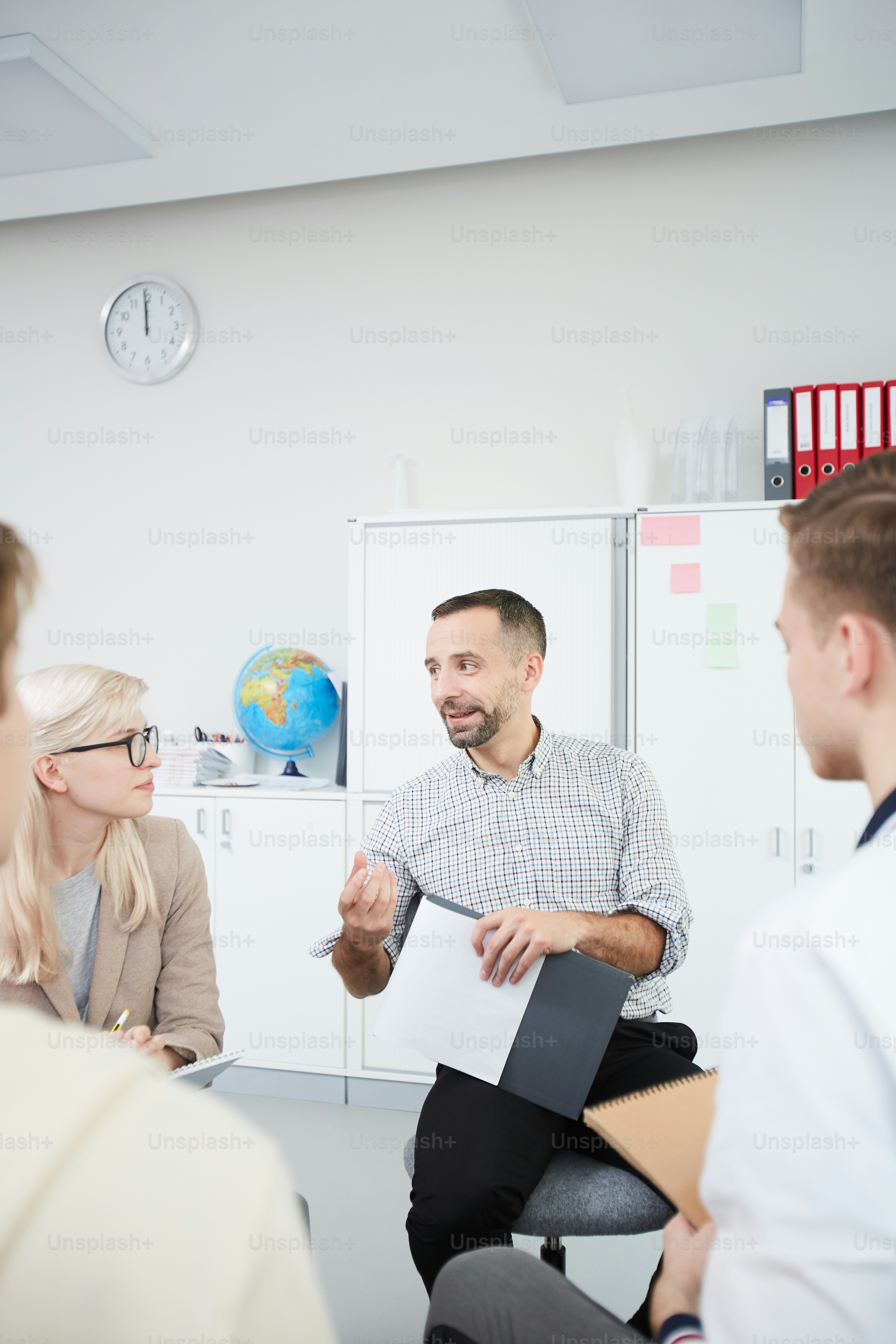 College teacher explaining one of curious moments of new subject with ...