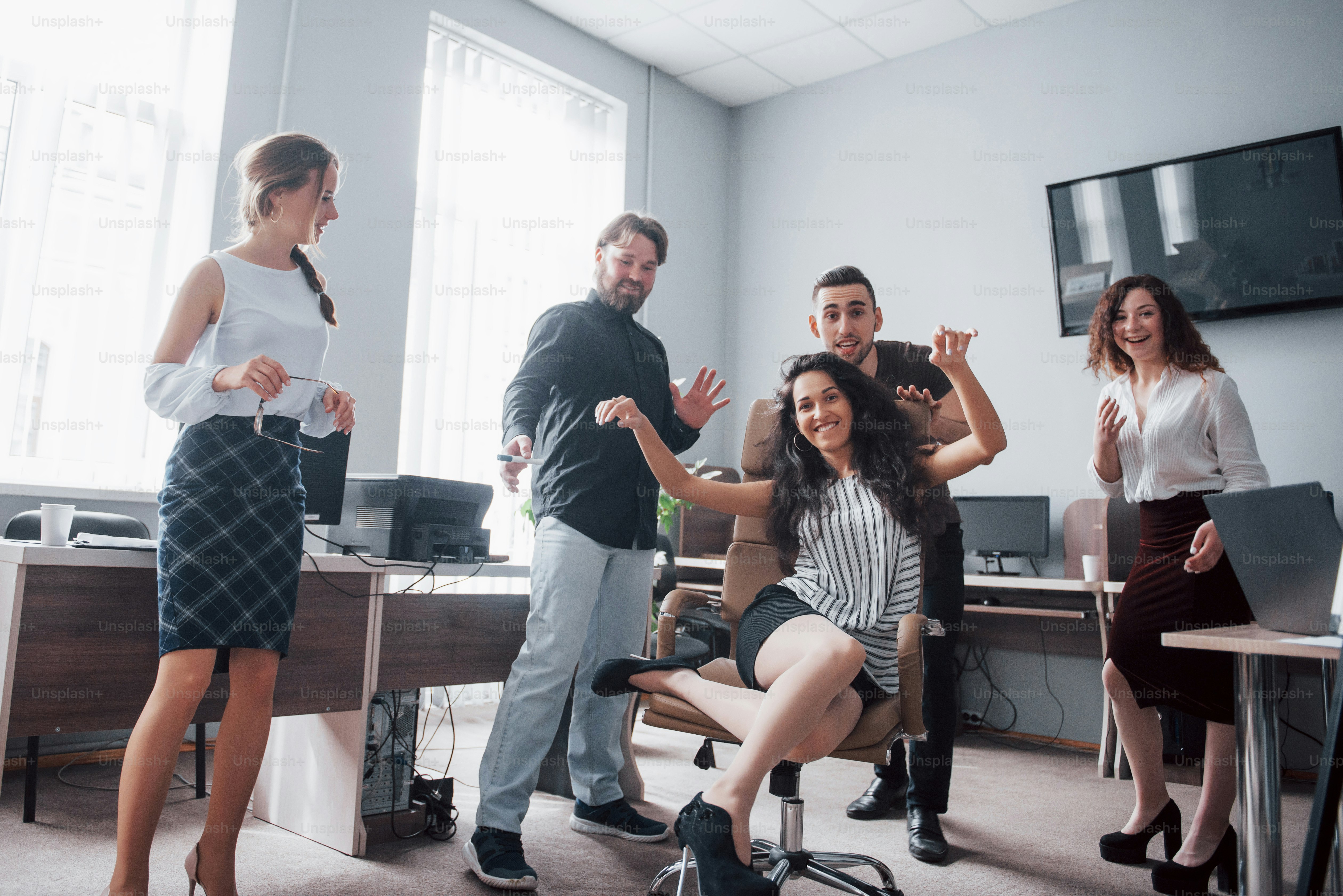 Happy young colleagues smile and have fun at the creative office photo ...