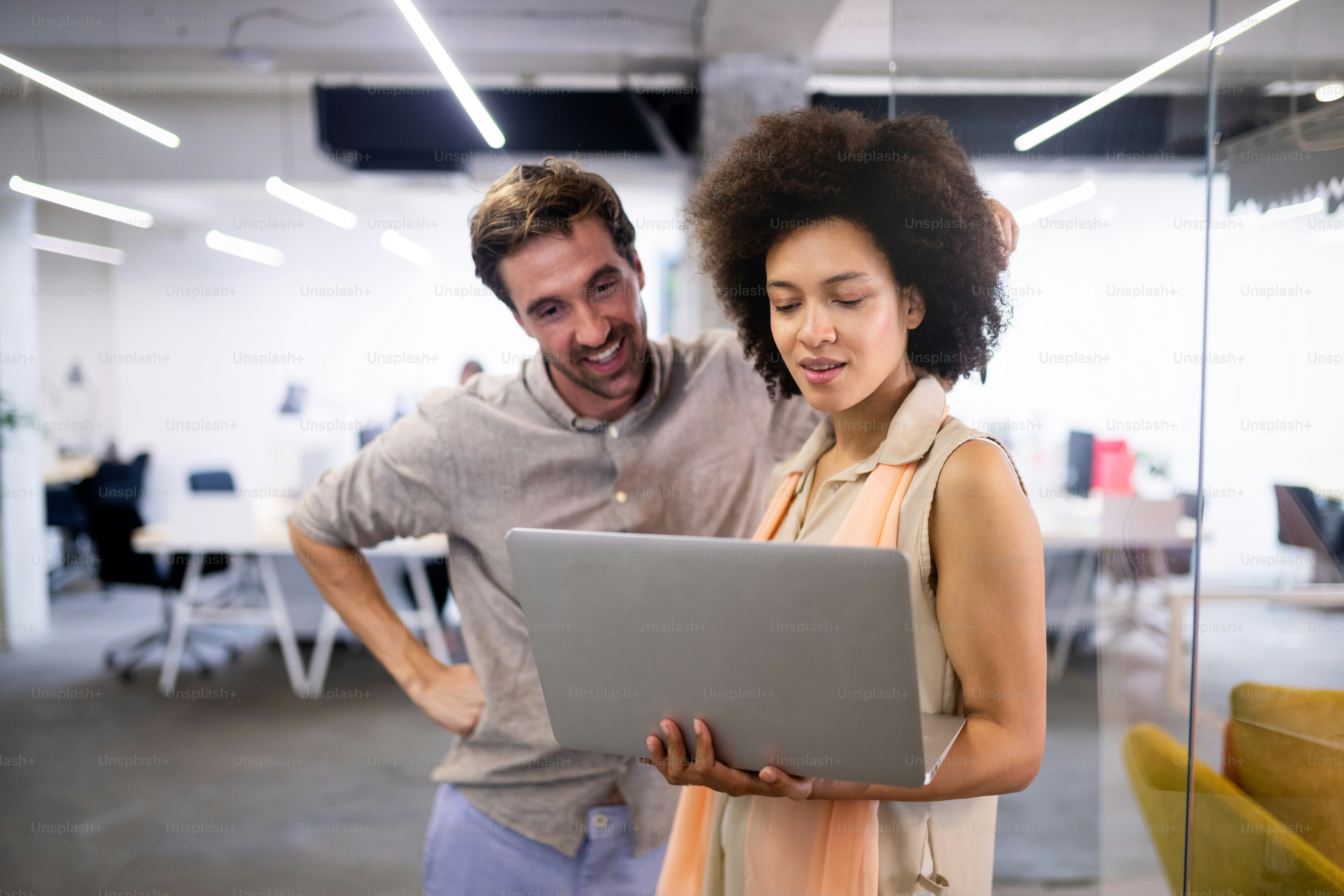 Programmers cooperating at modern IT company developing apps photo ...