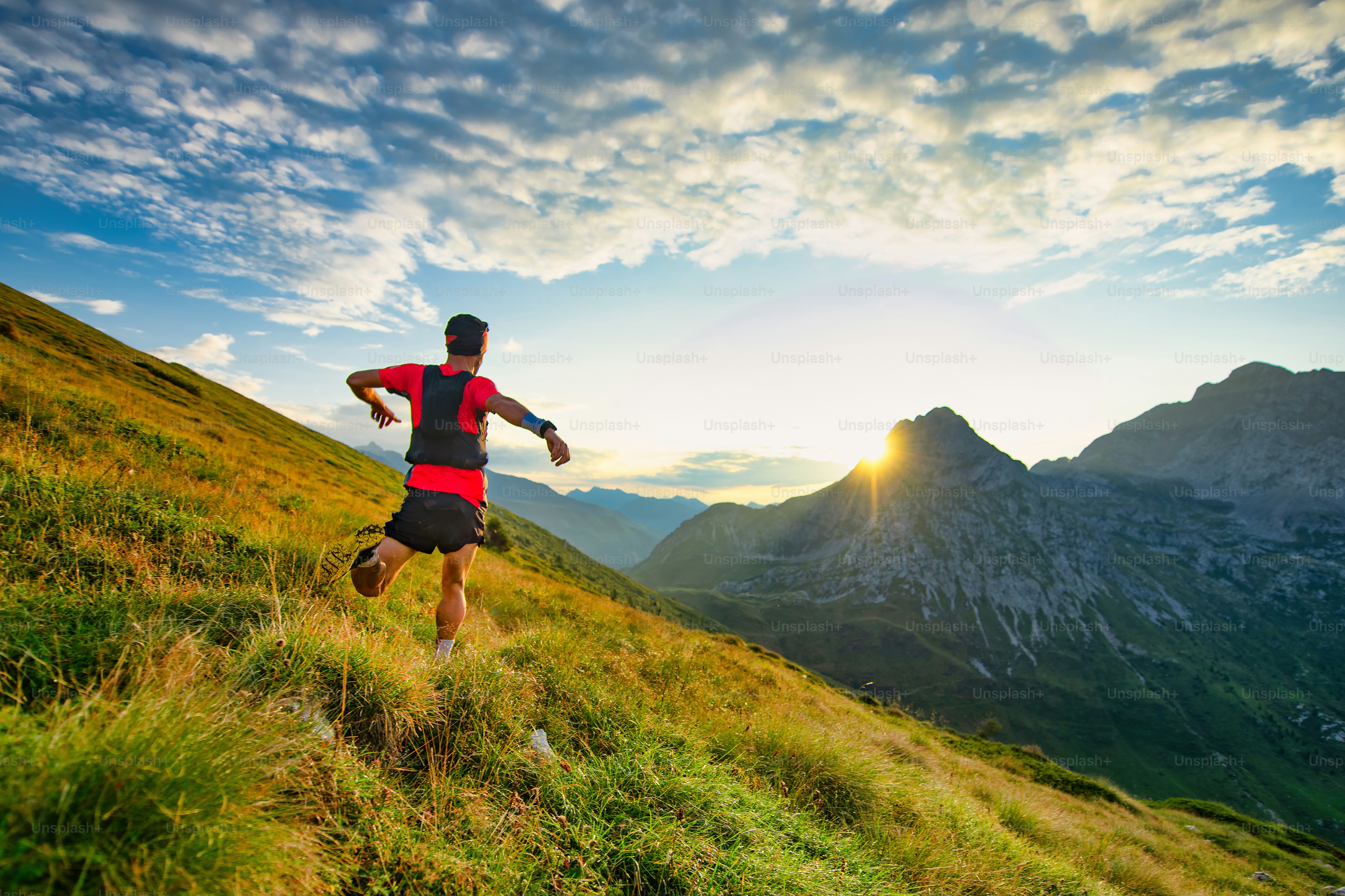 Runner skyrunner on a mountain meadow at dawn photo – Exercising Image ...