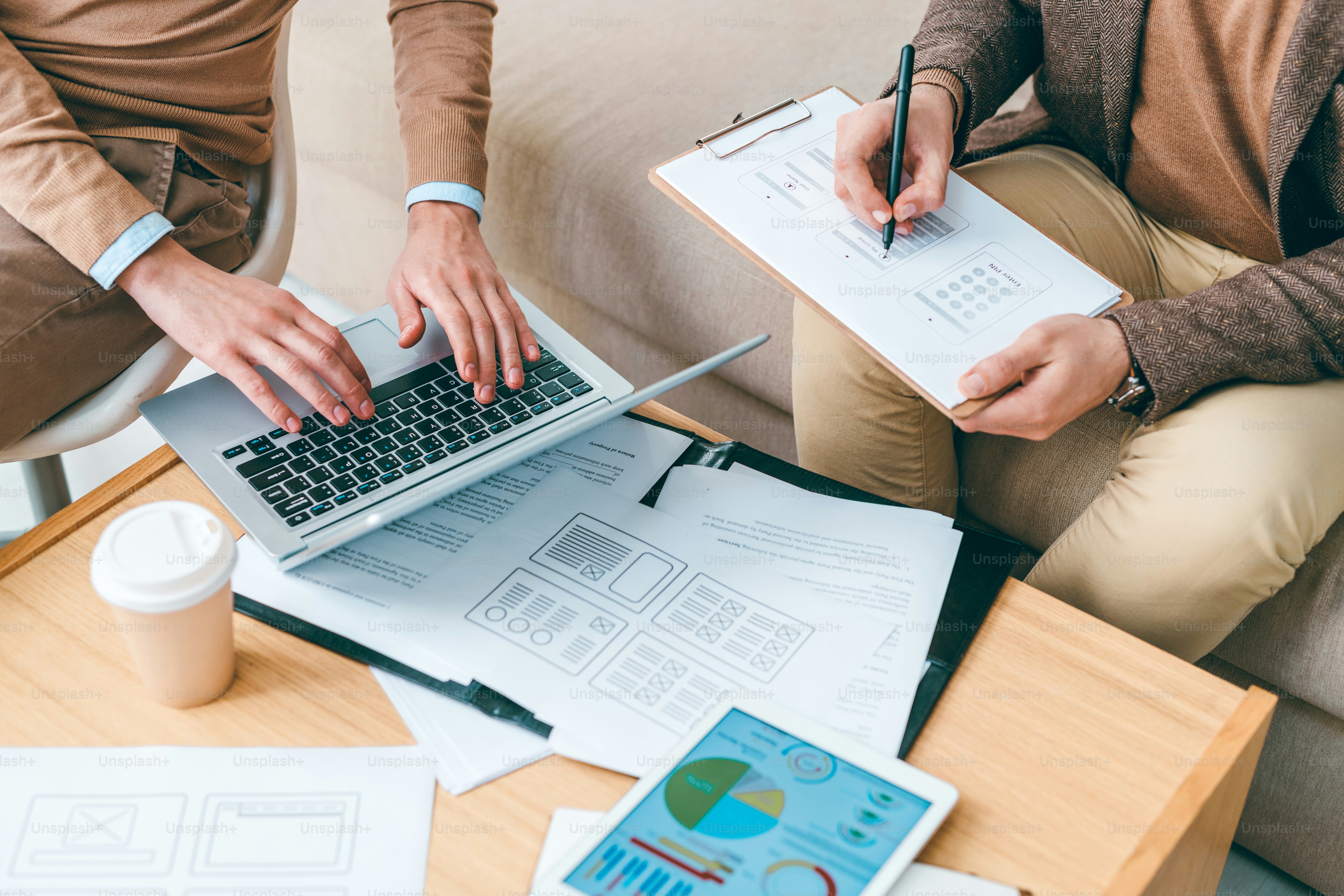 Teamwork of young creative programmers or designers of software working ...