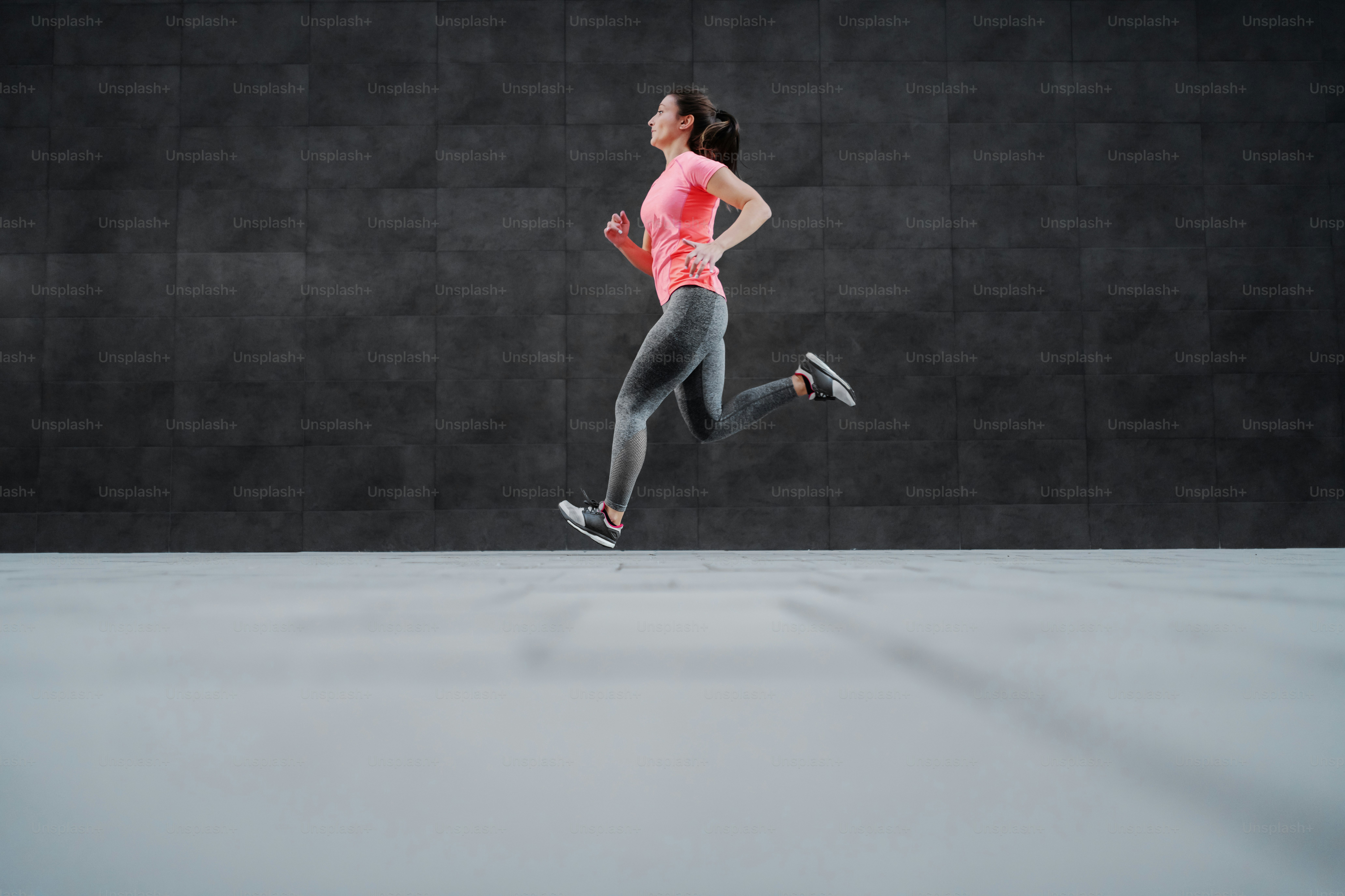 Side view of fit attractive Caucasian woman in sportswear and with ...