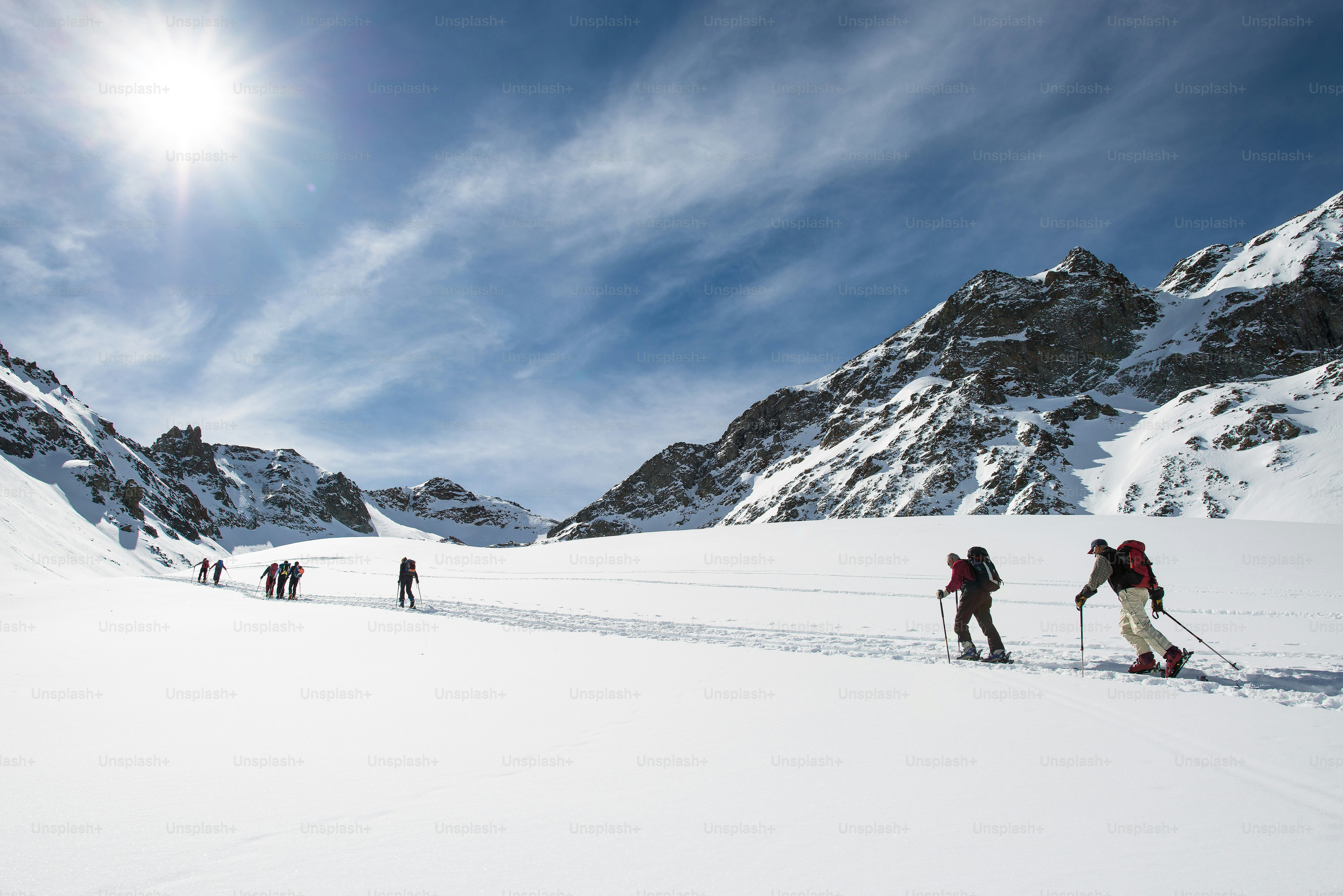 Group of ski mountaineers during a trip on the alps photo – Winter ...
