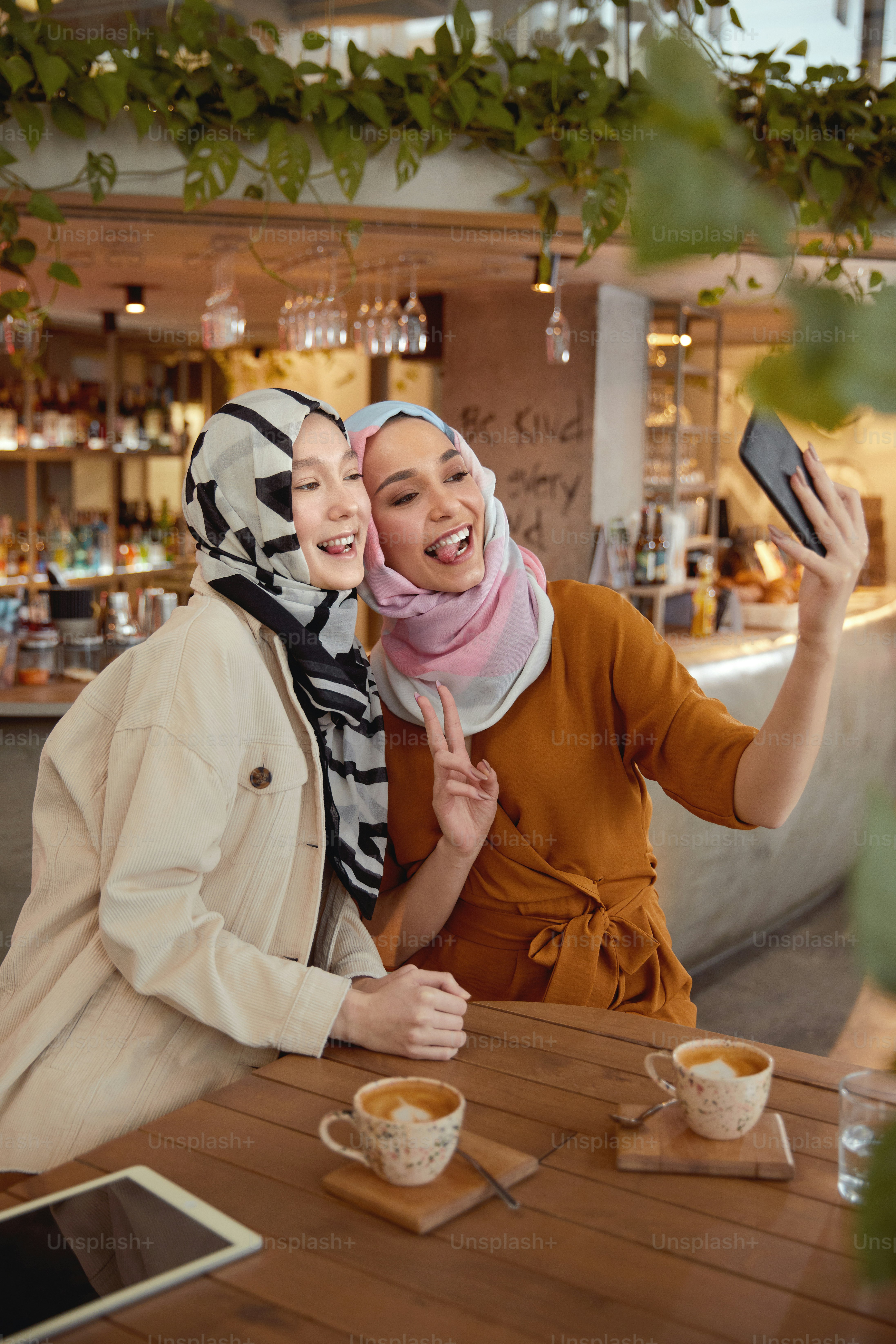 Women. Friends Meeting In Cafe. Smiling Girls Looking At Tablet Screen ...