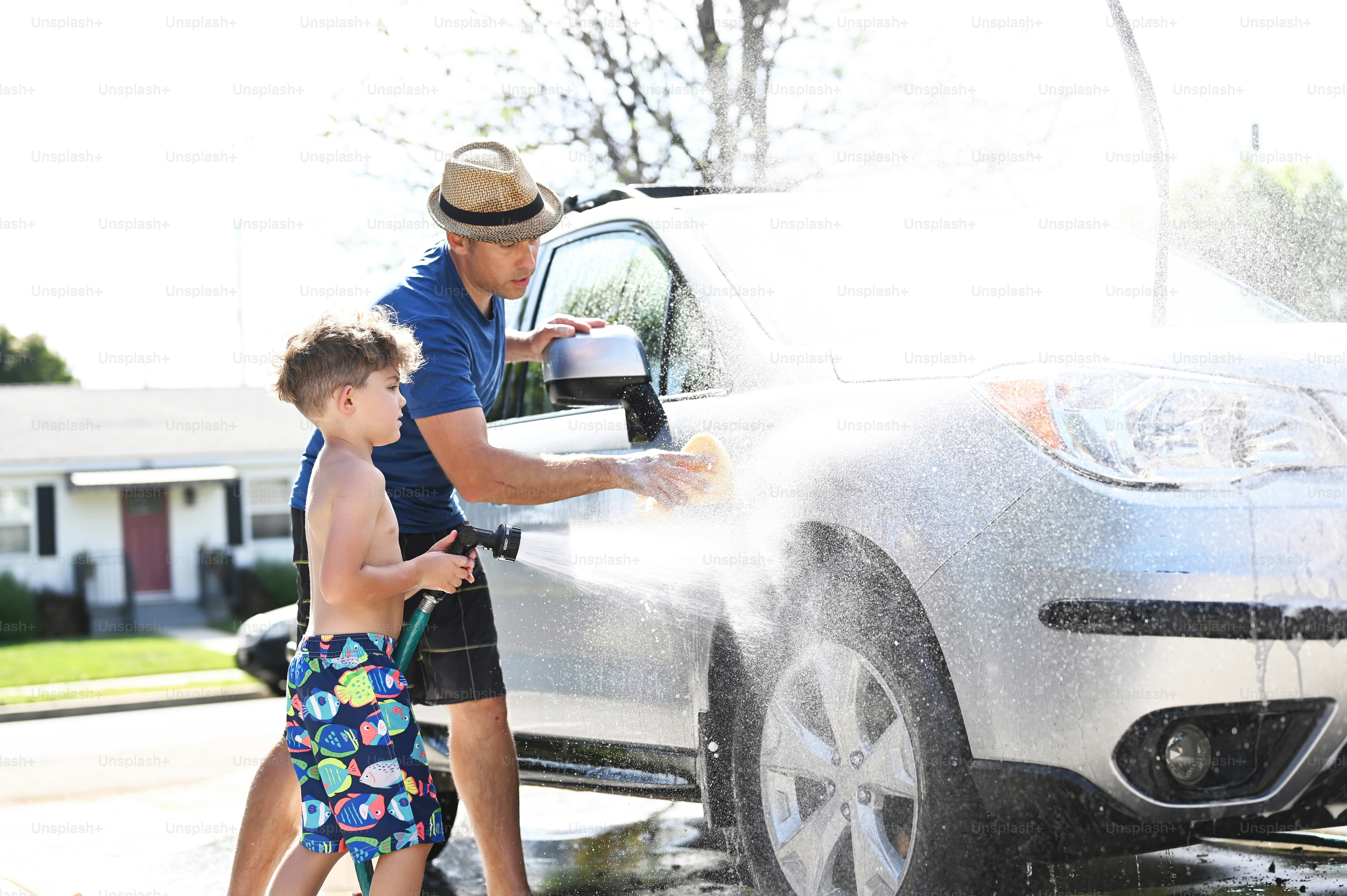 A man and a boy are washing a car photo – Bonding Image on Unsplash
