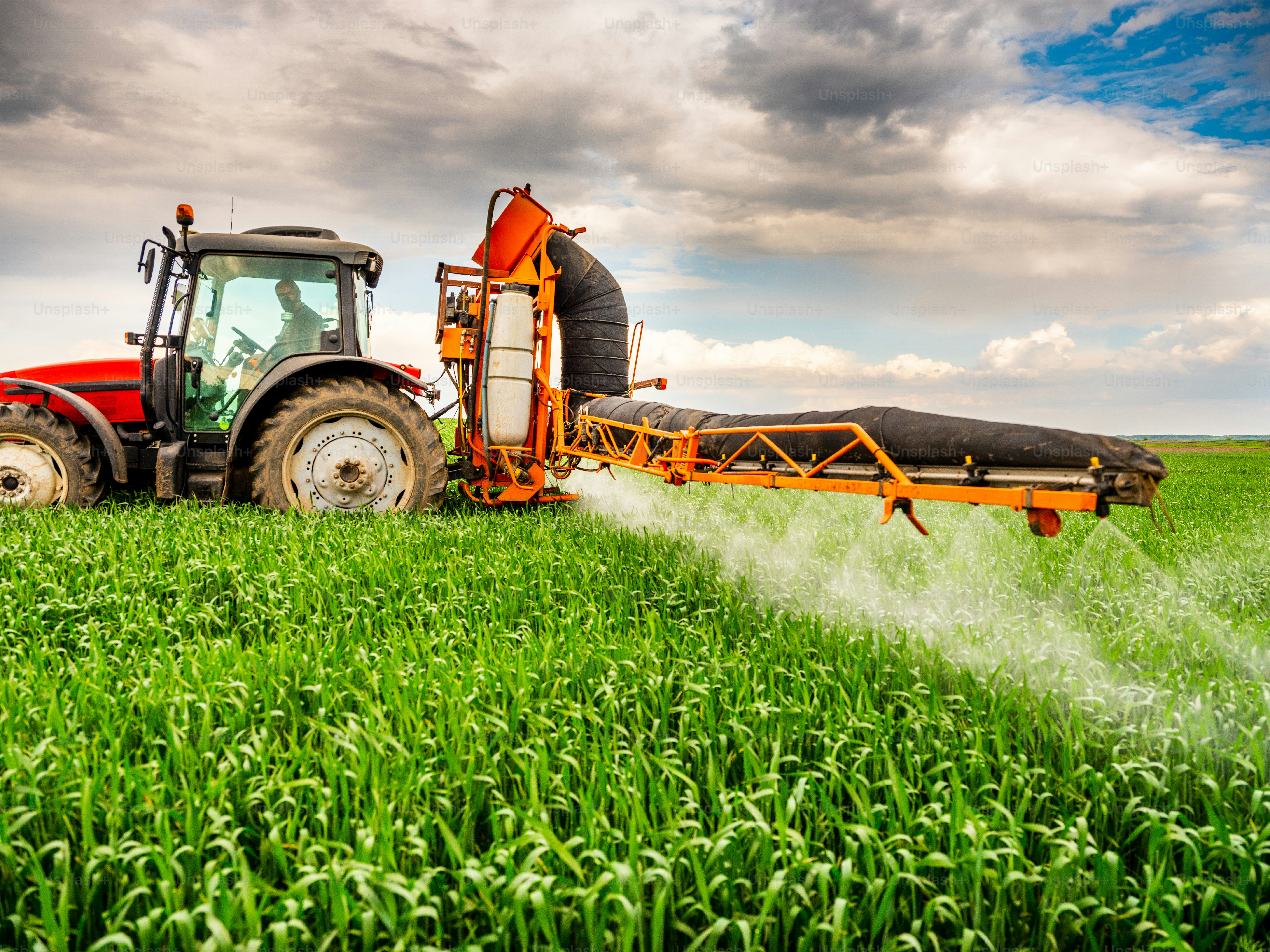 Farmer spraying wheat crops photo – Nature Image on Unsplash