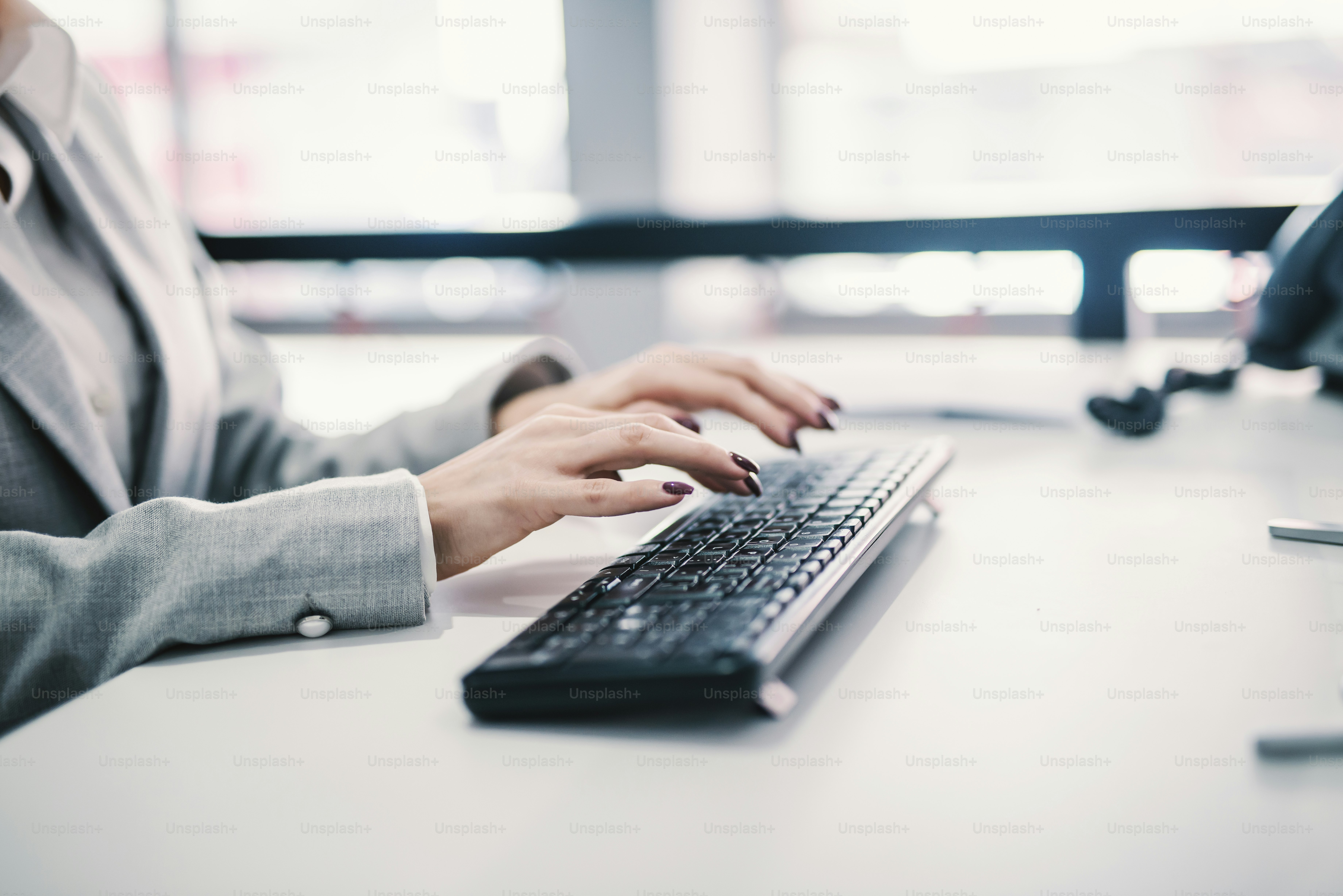 Close up of hands typing documentation on computer at office. photo ...