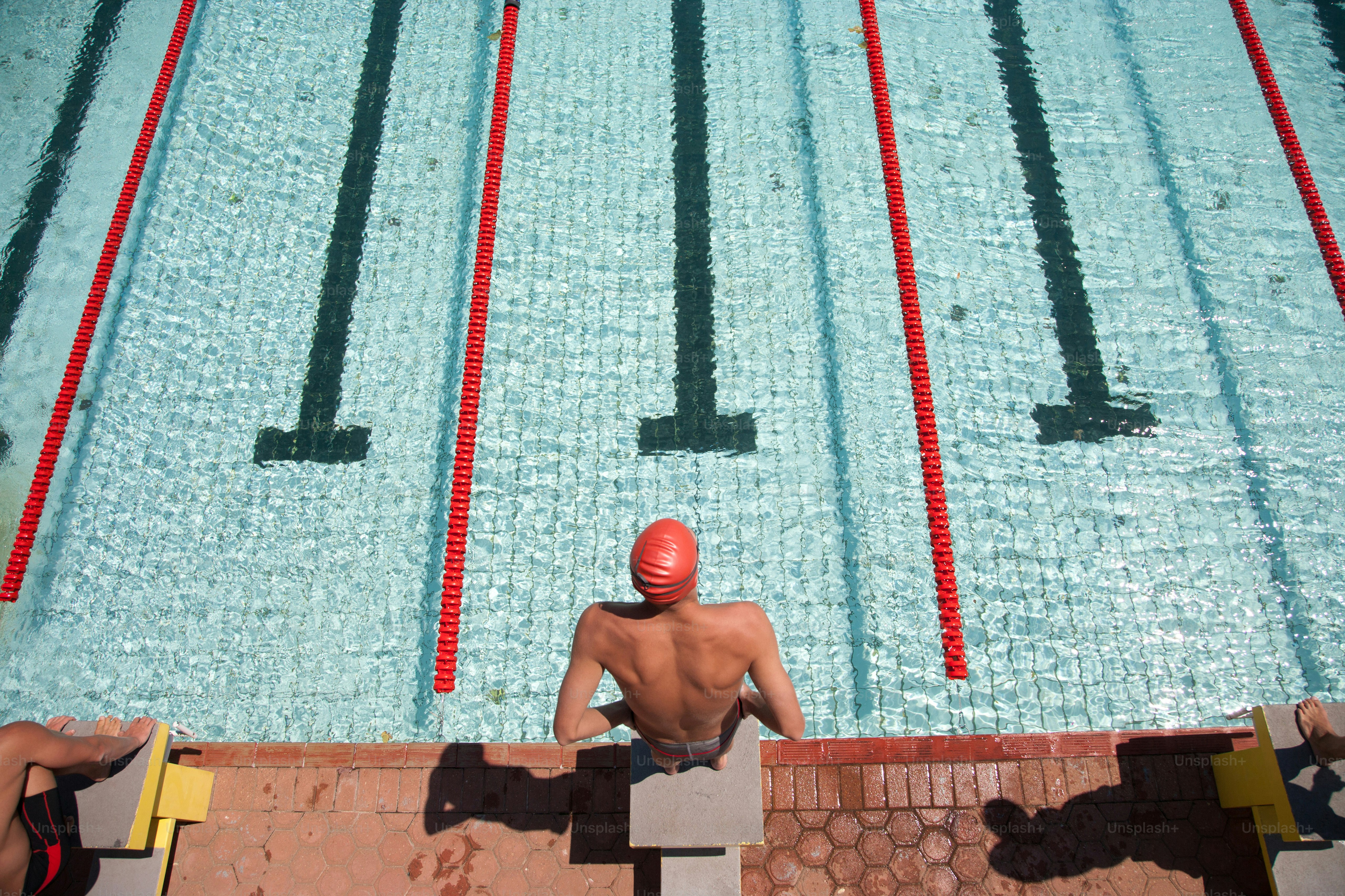 A man diving into a swimming pool photo – Dive Image on Unsplash