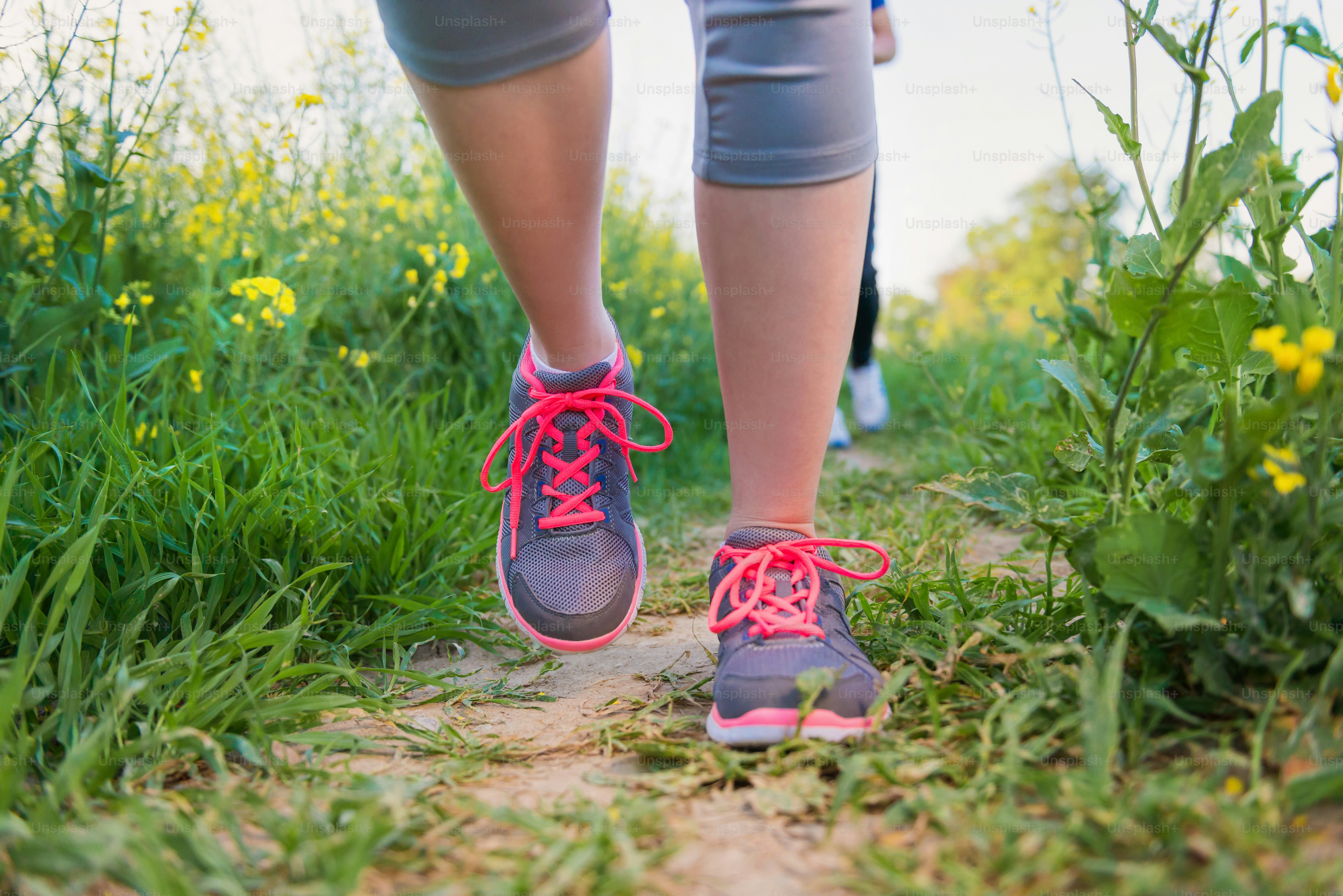 Feet of a young runner training outside in spring nature photo – Nature ...