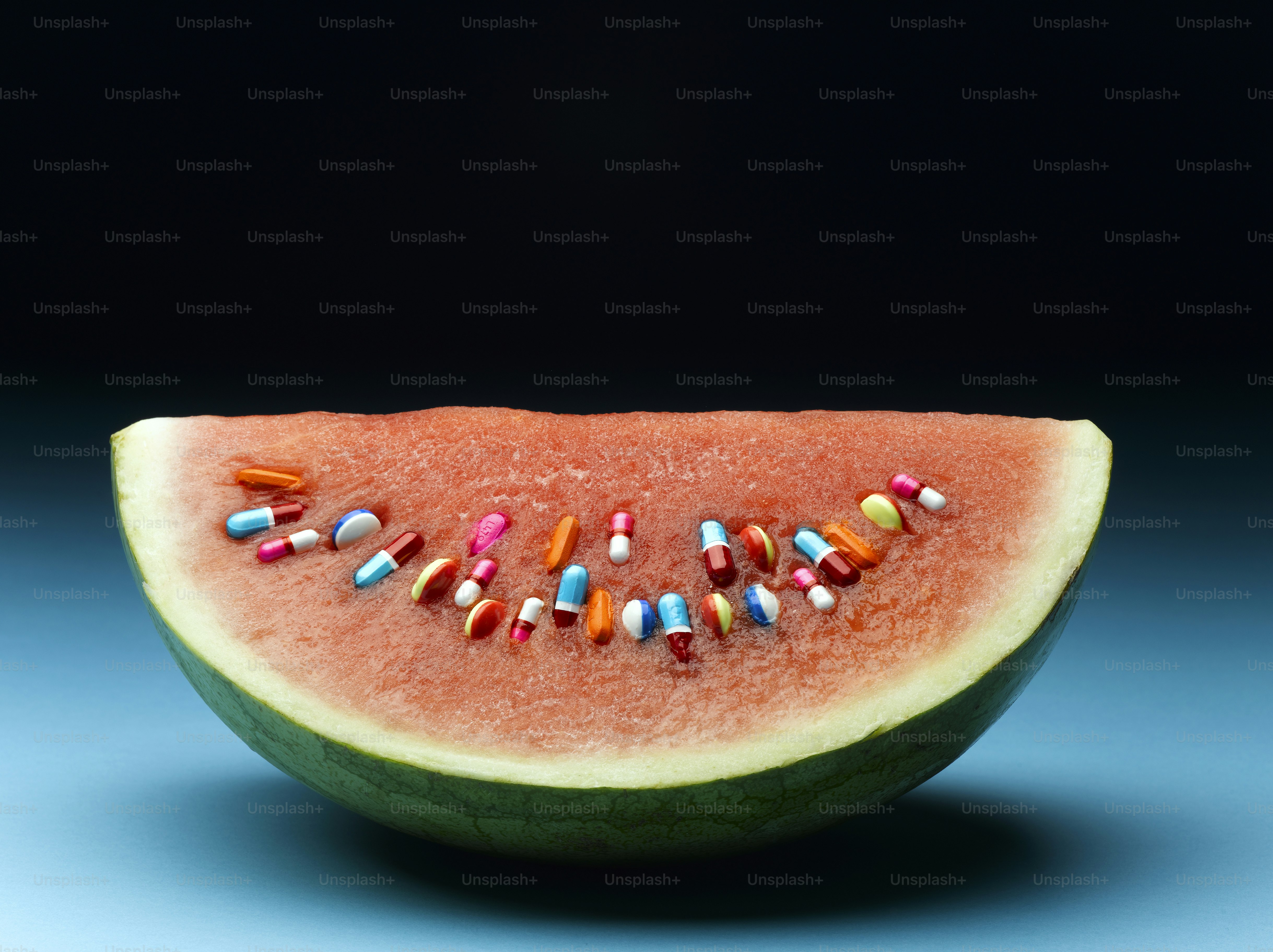 A slice of watermelon with pills on it photo – No people Image on Unsplash
