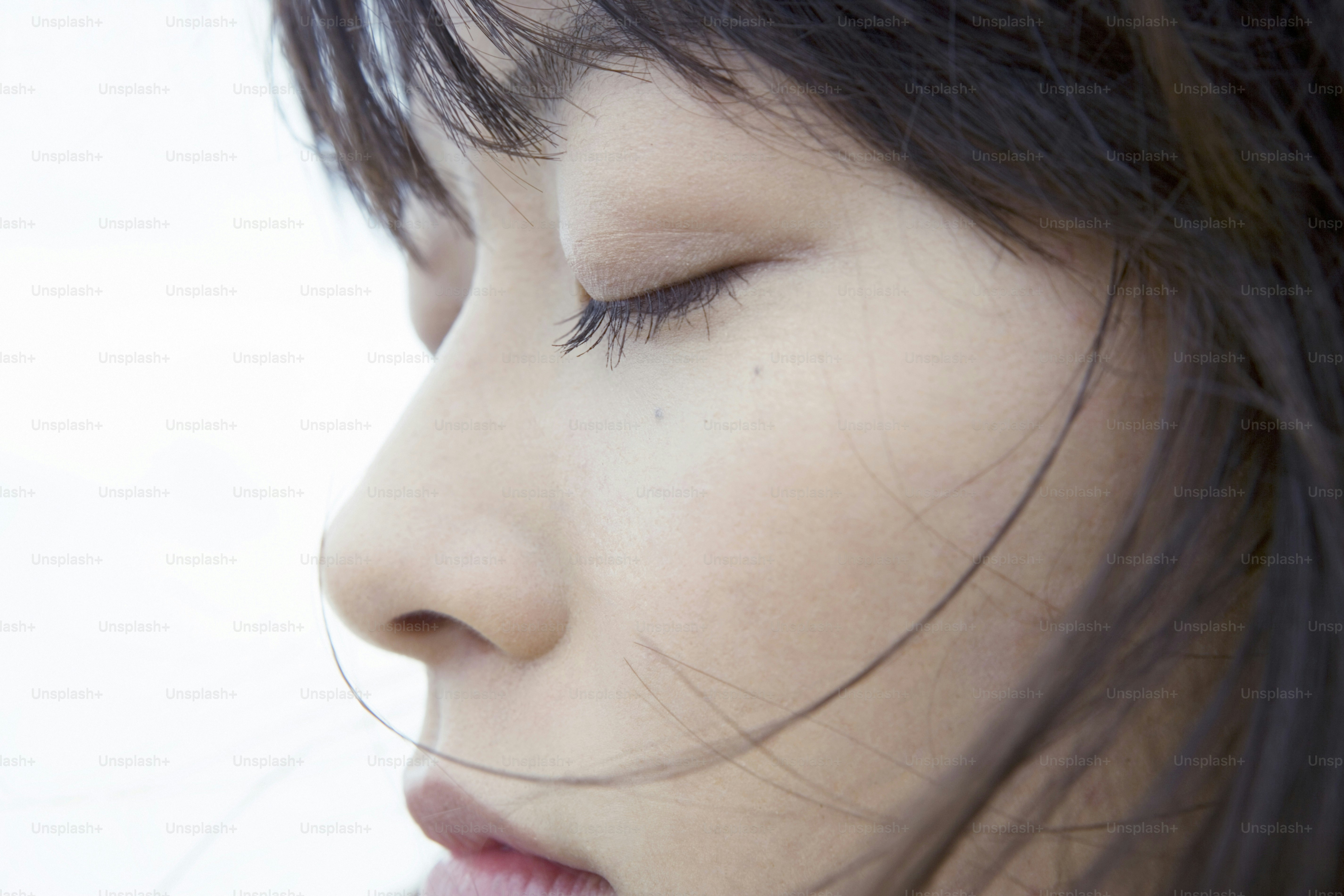 A close up of a woman with her eyes closed photo – One person Image on ...