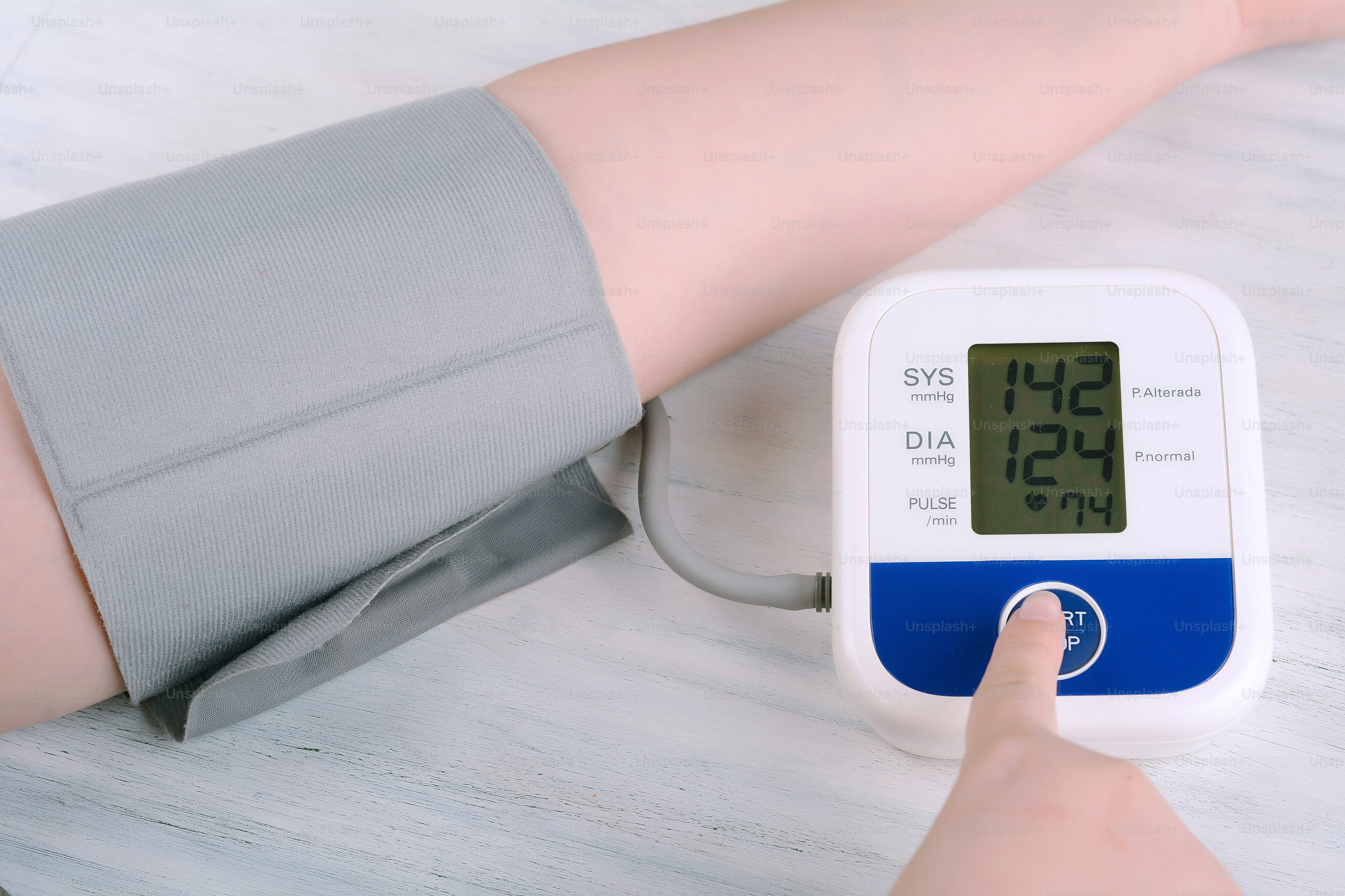 Close up view of person measuring his blood pressure. Medicine concept ...