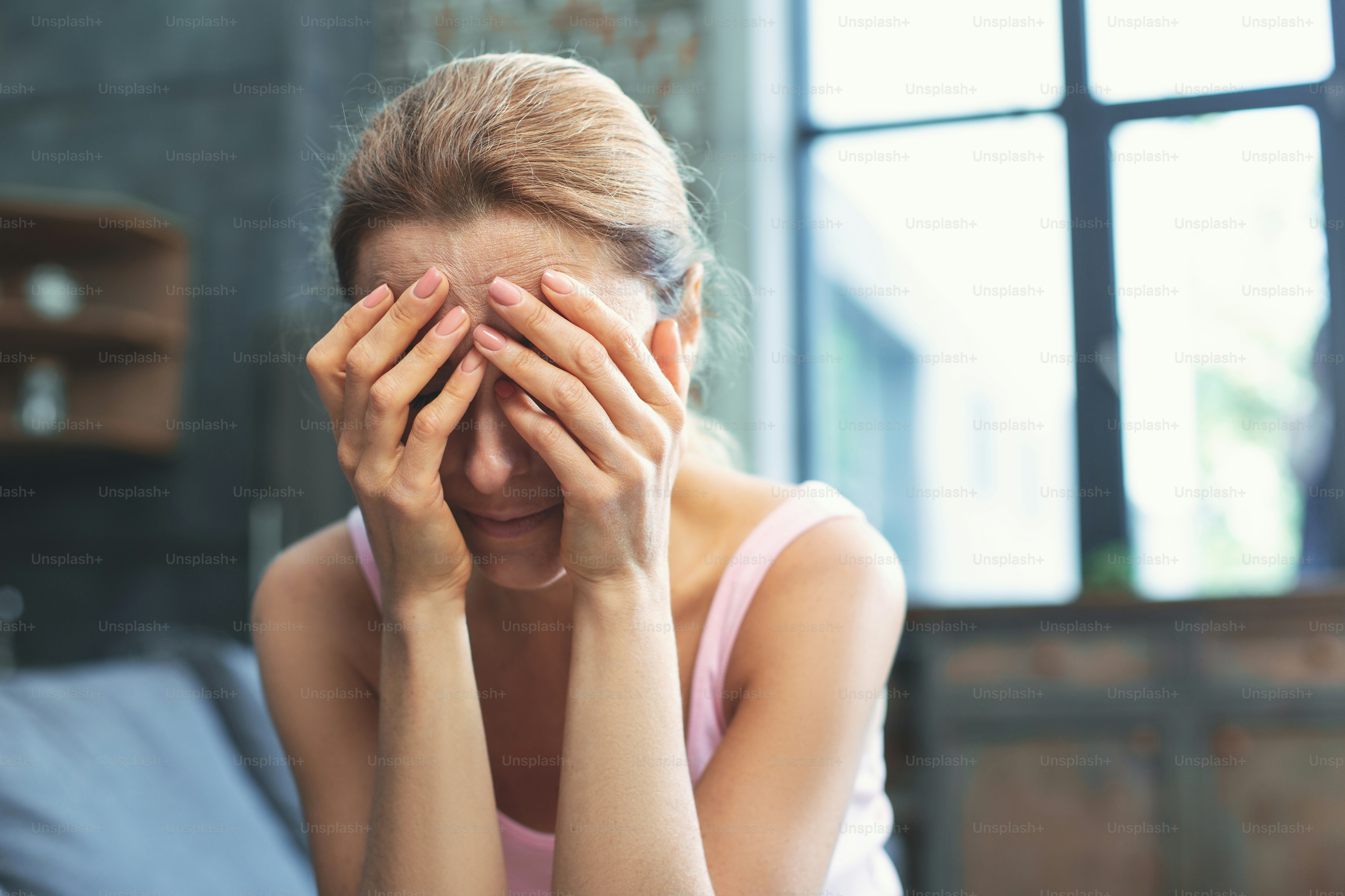 Emotional burden. Mournful mature woman covering face and weeping photo ...