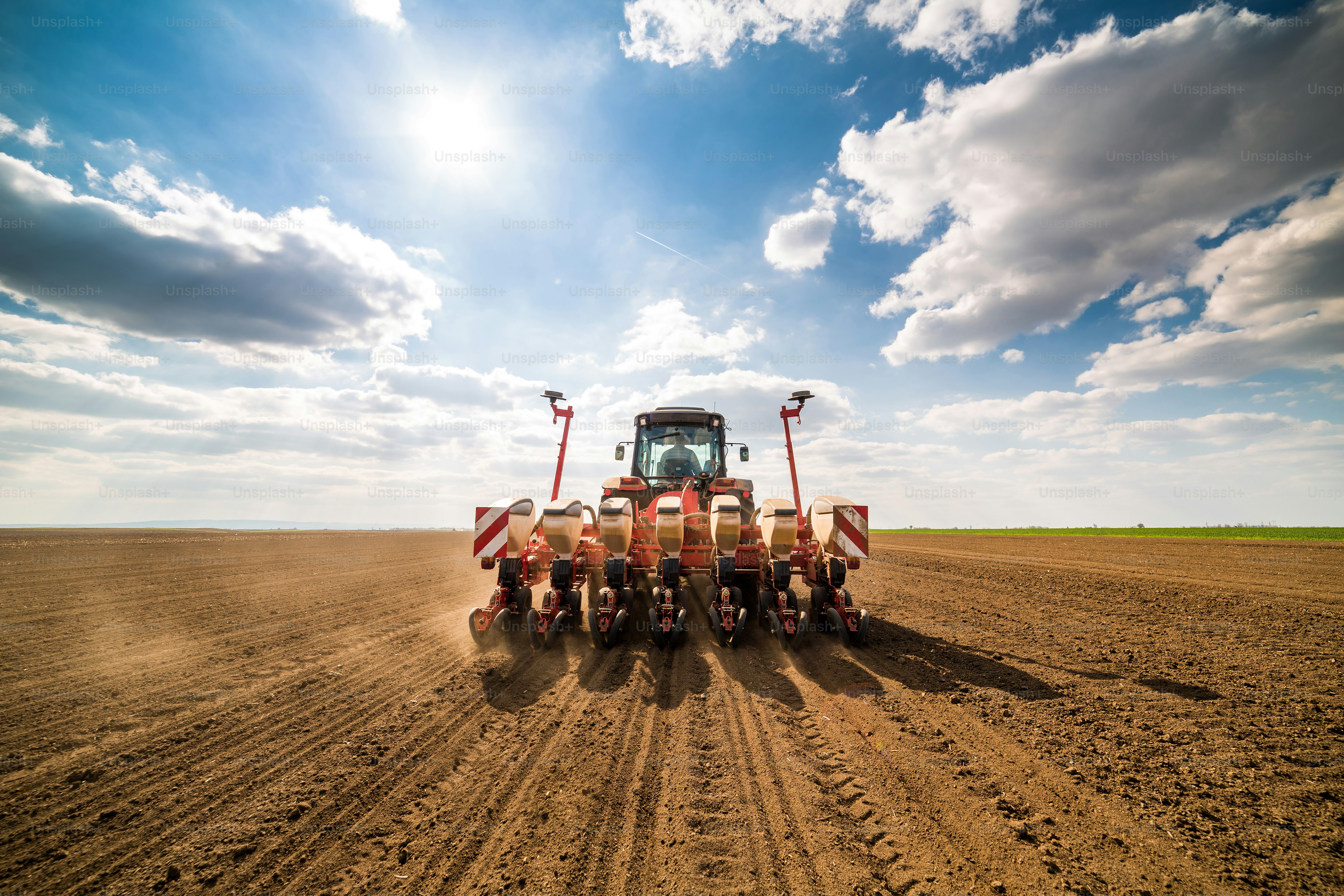 Farmer seeding, sowing crops at field. Sowing is the process of ...
