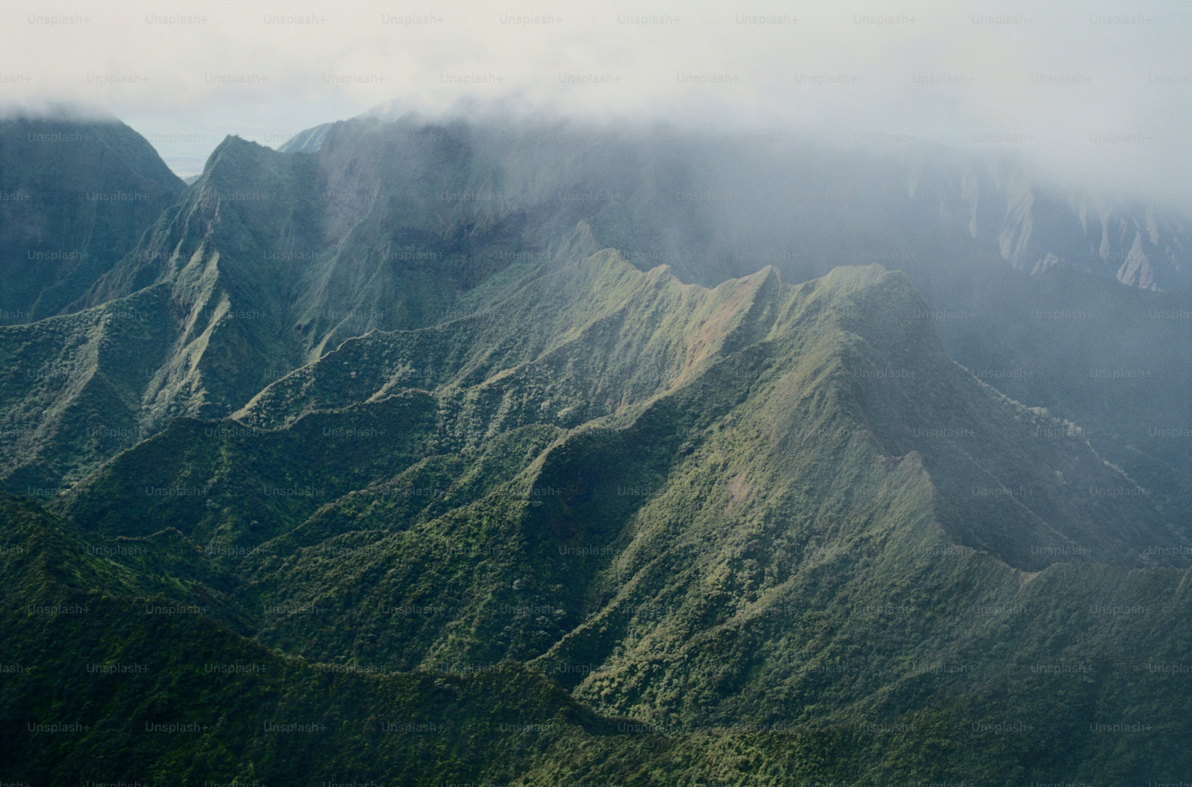 A view of a mountain range from a plane photo – Photography Image on ...