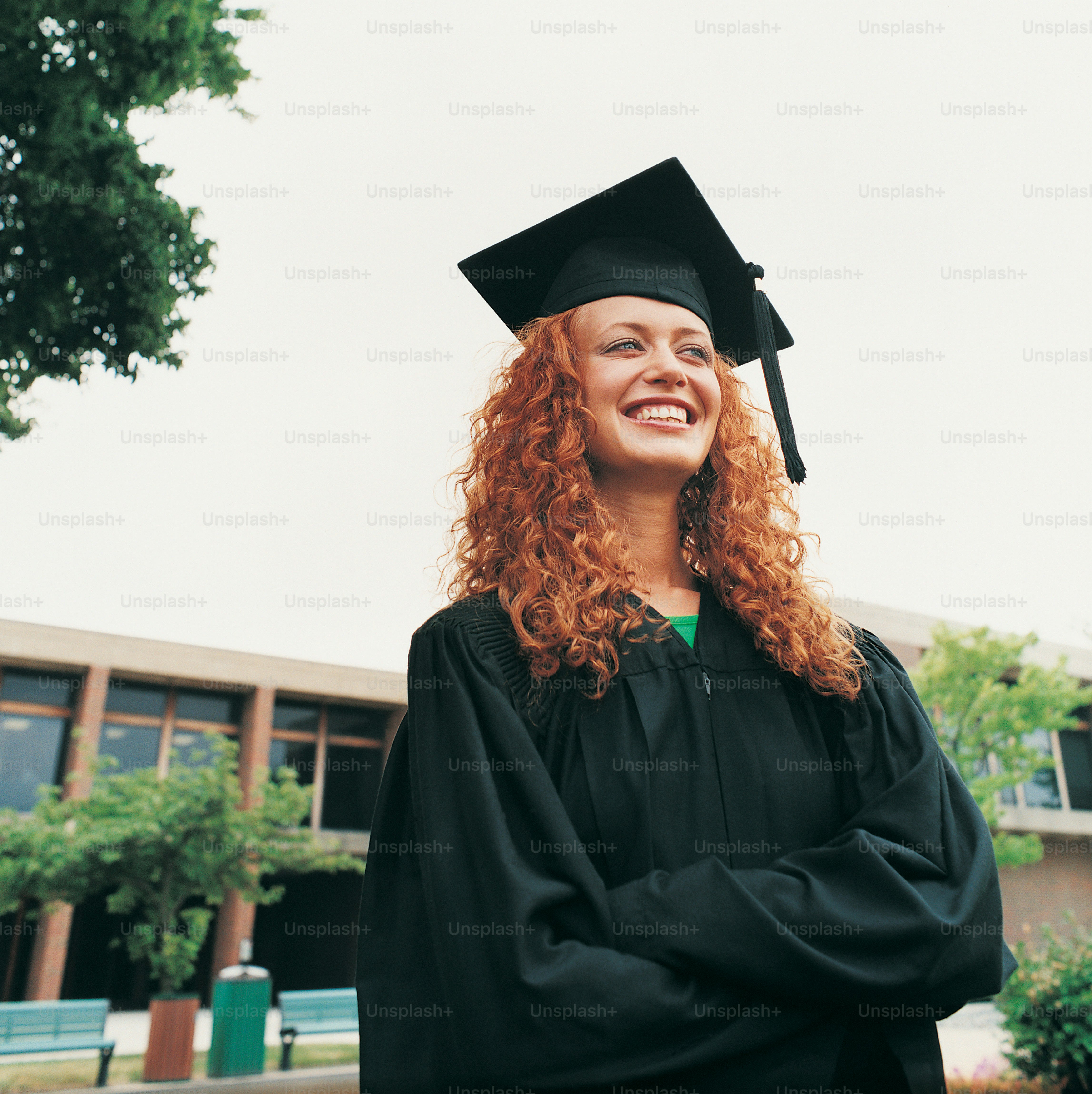 A woman in a graduation cap and gown photo – College student Image on ...