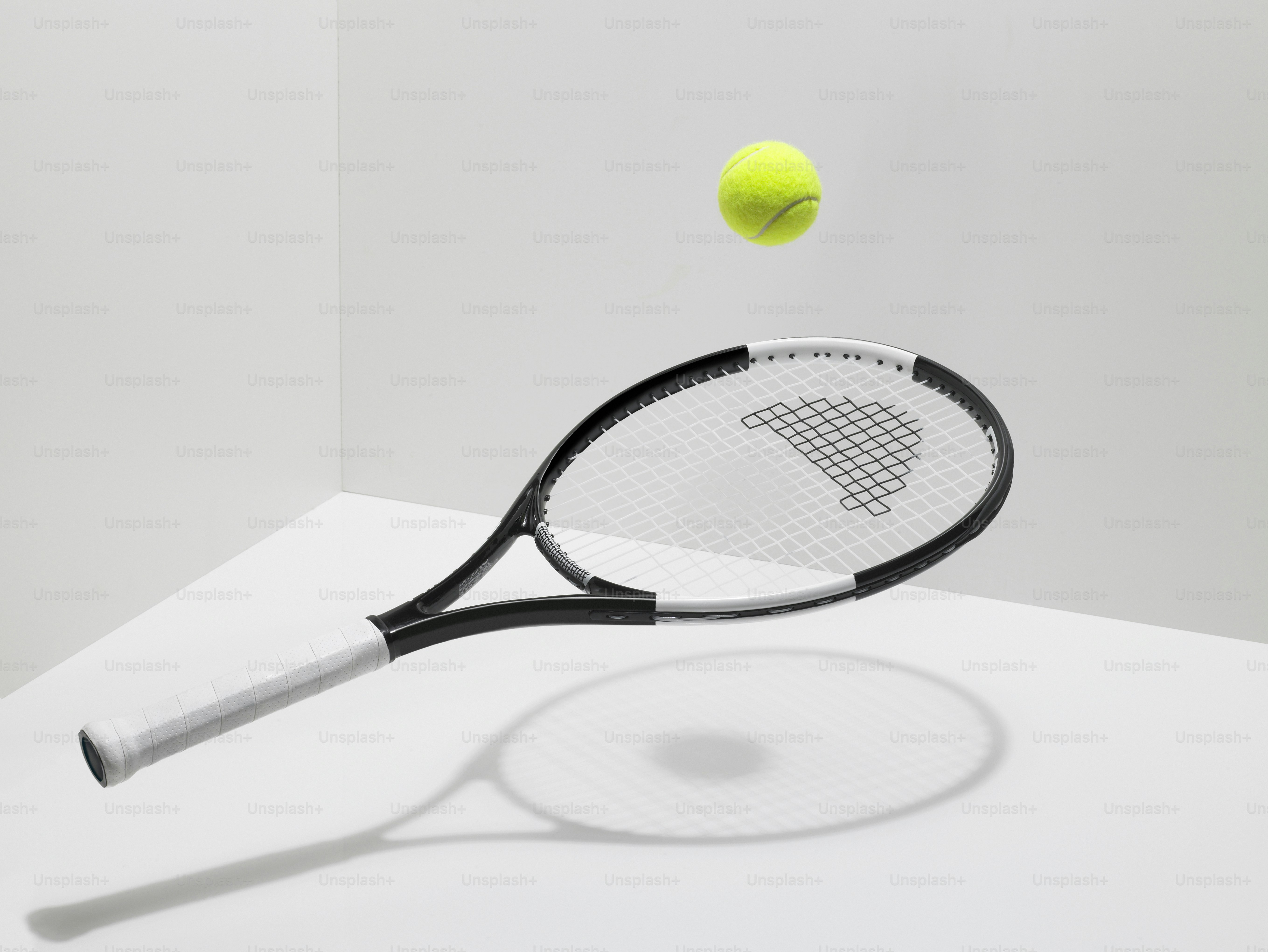 A tennis racket hitting a tennis ball photo – Tennis racket Image on ...