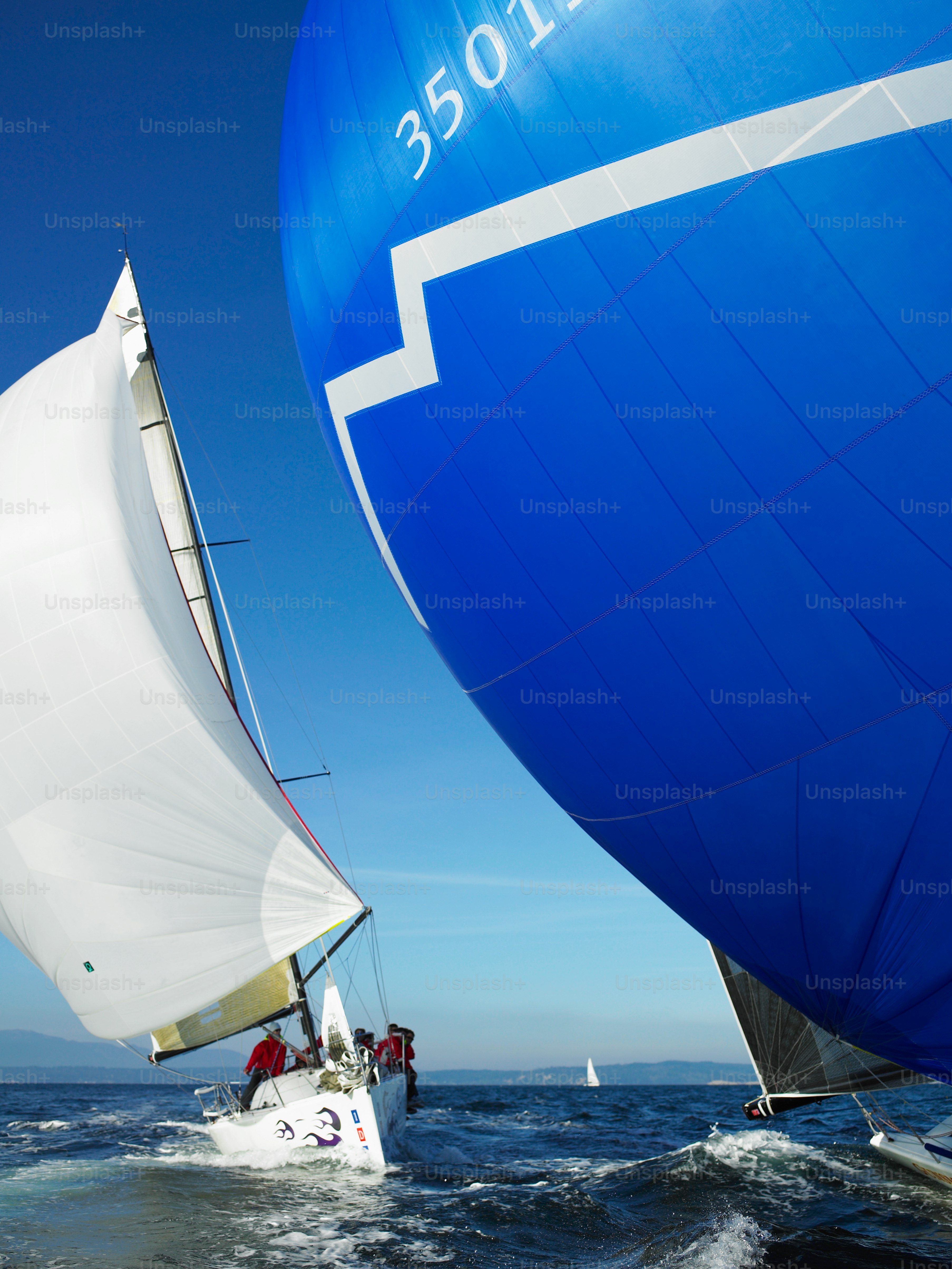 Two sailboats in the ocean on a sunny day photo – People Image on Unsplash