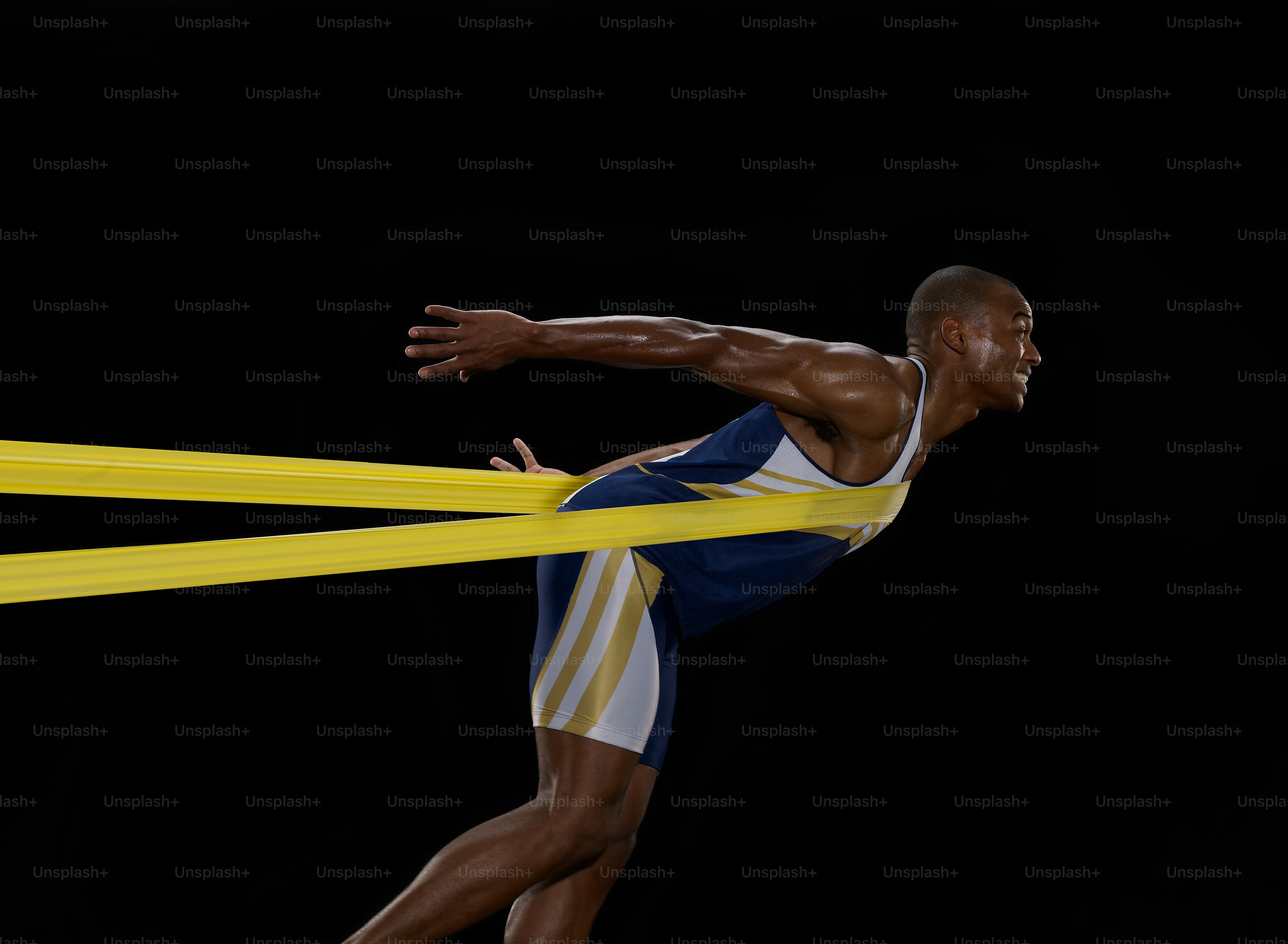 A man is doing a trick with a yellow hula hoop photo – Finish line ...