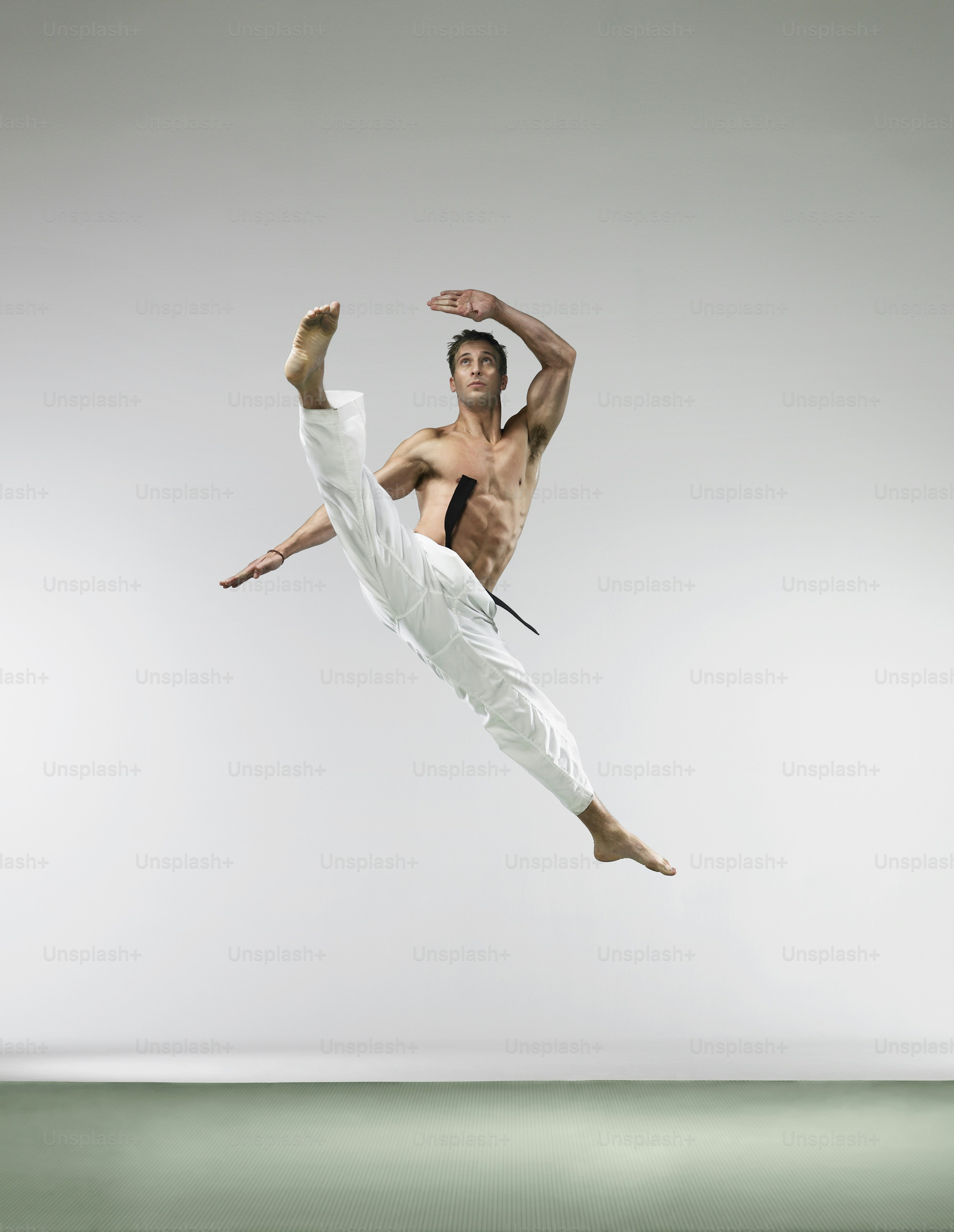 A man doing a kickbox kick in the air photo – People Image on Unsplash