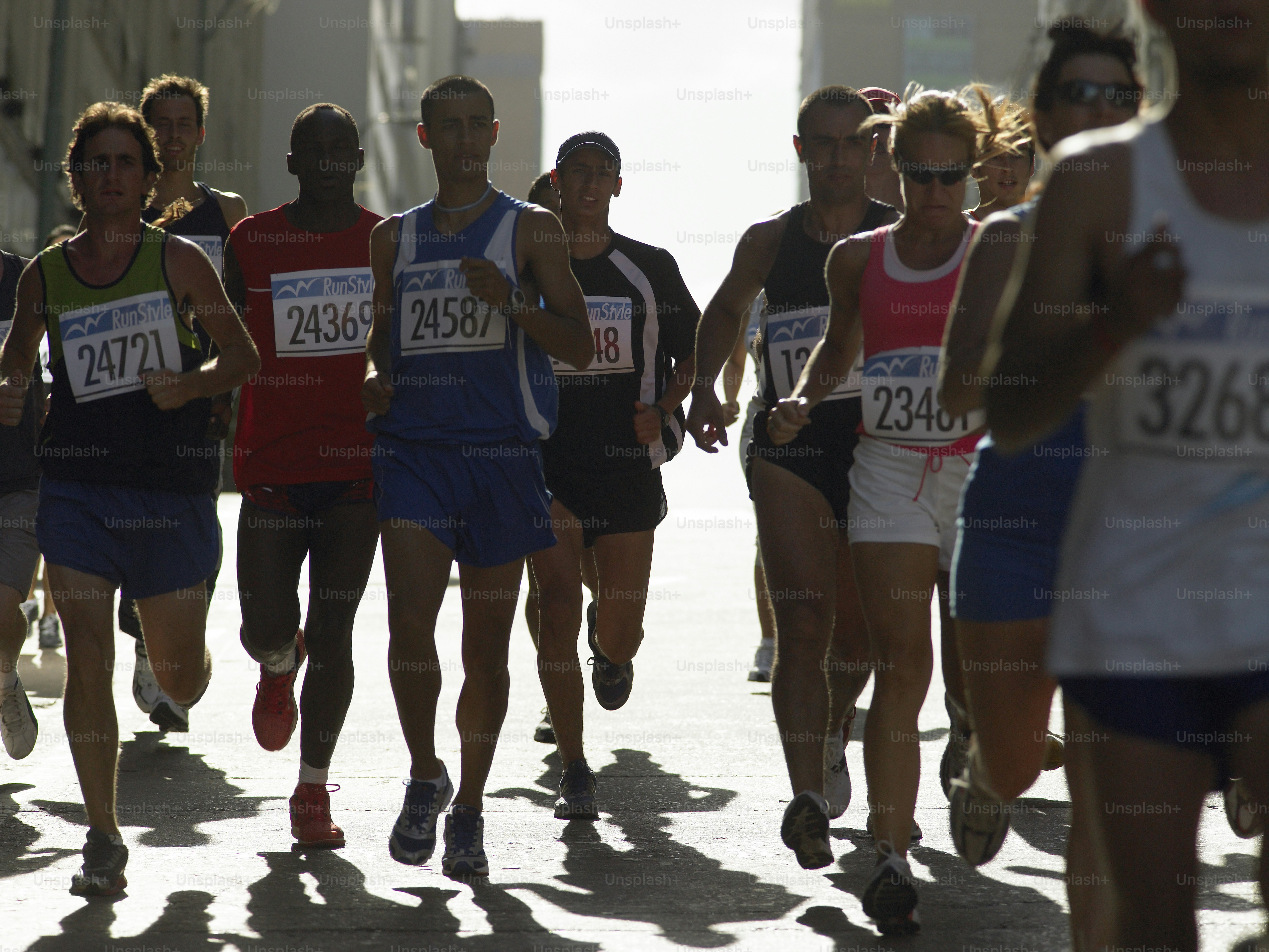 A group of people that are running in a race photo – Running Image on ...