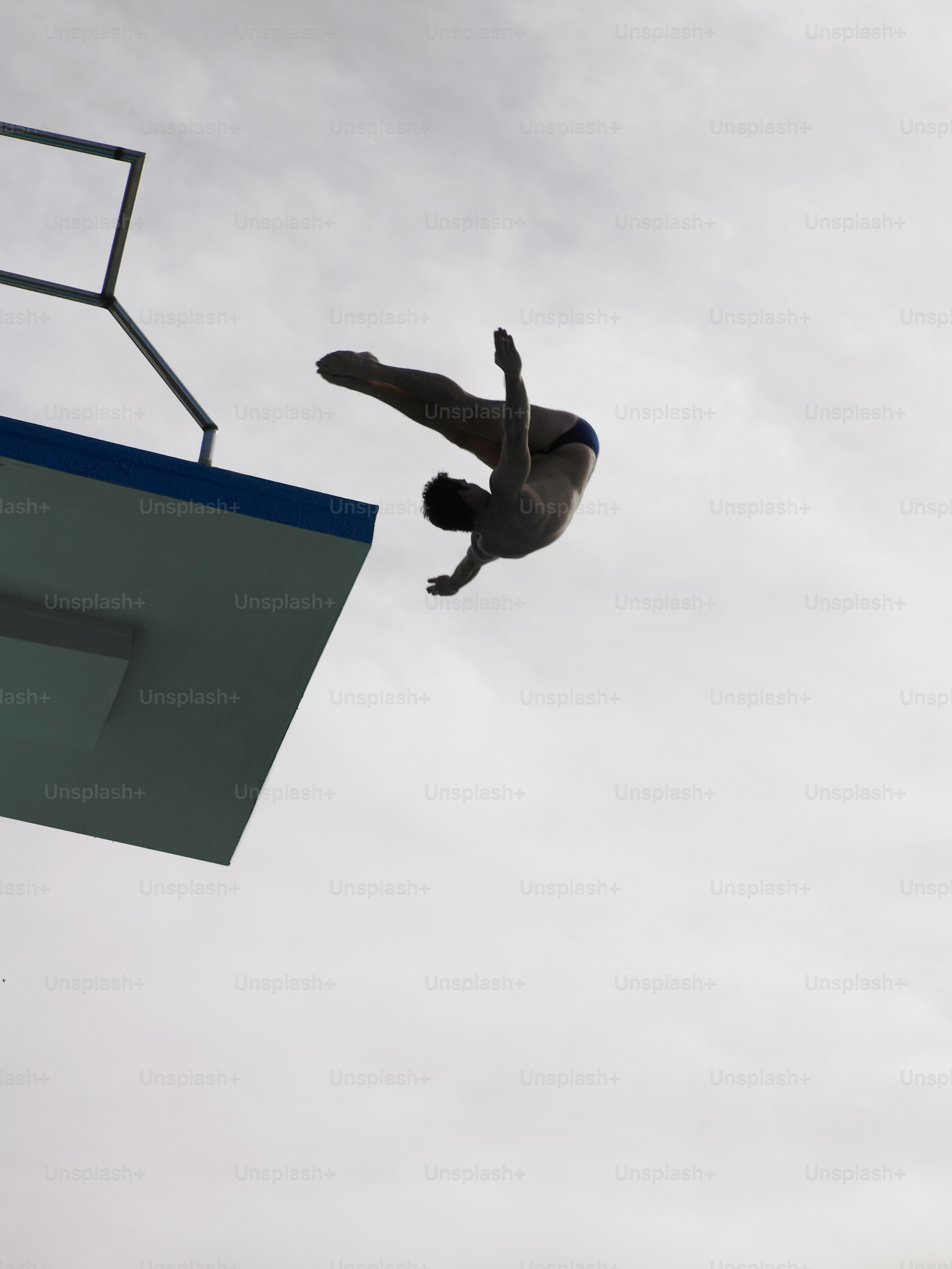 A man flying through the air while riding a skateboard photo – Diving ...