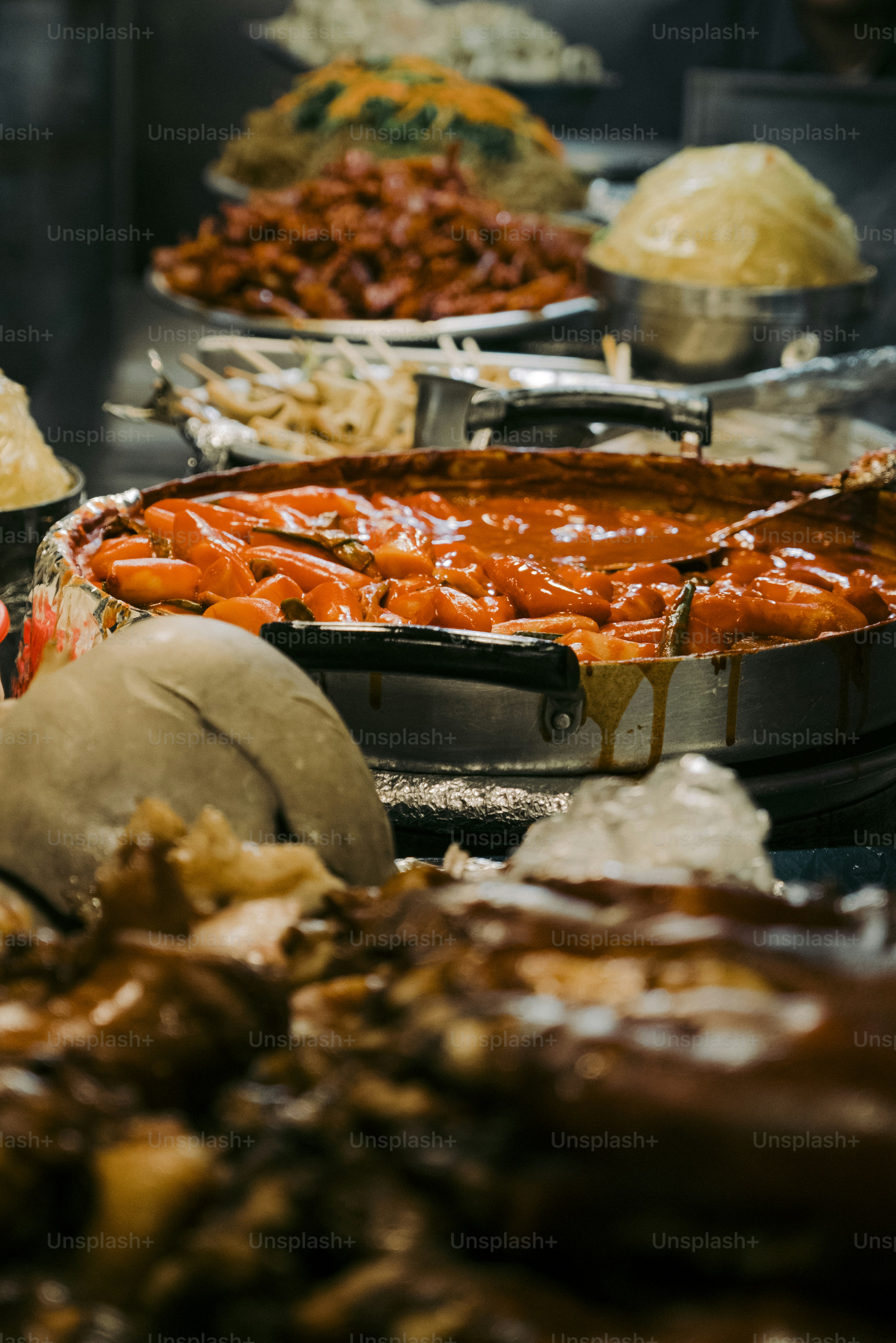 A buffet table filled with lots of different types of food photo – Food ...