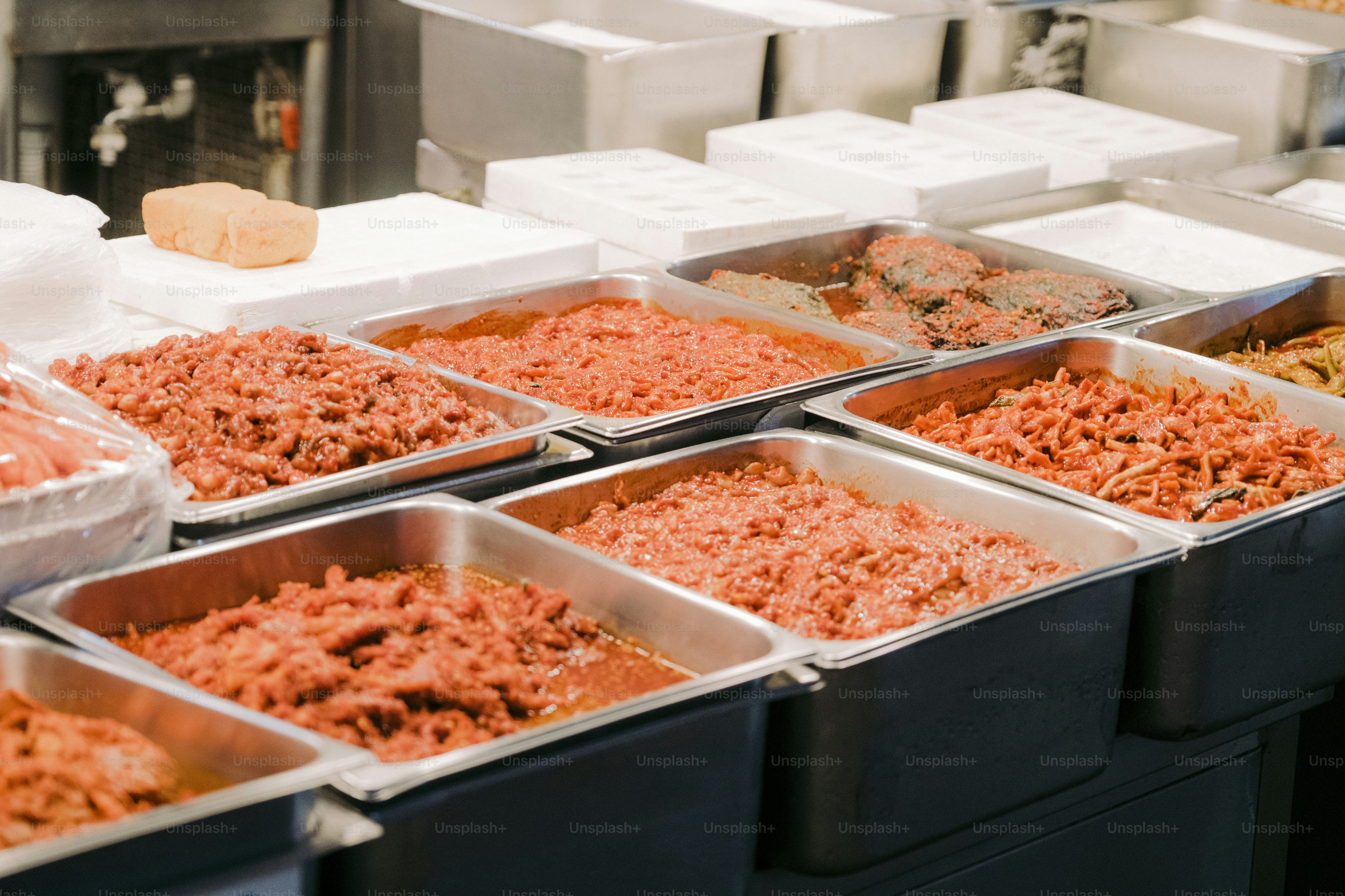 A bunch of trays of food that are on a table photo – Food Image on Unsplash