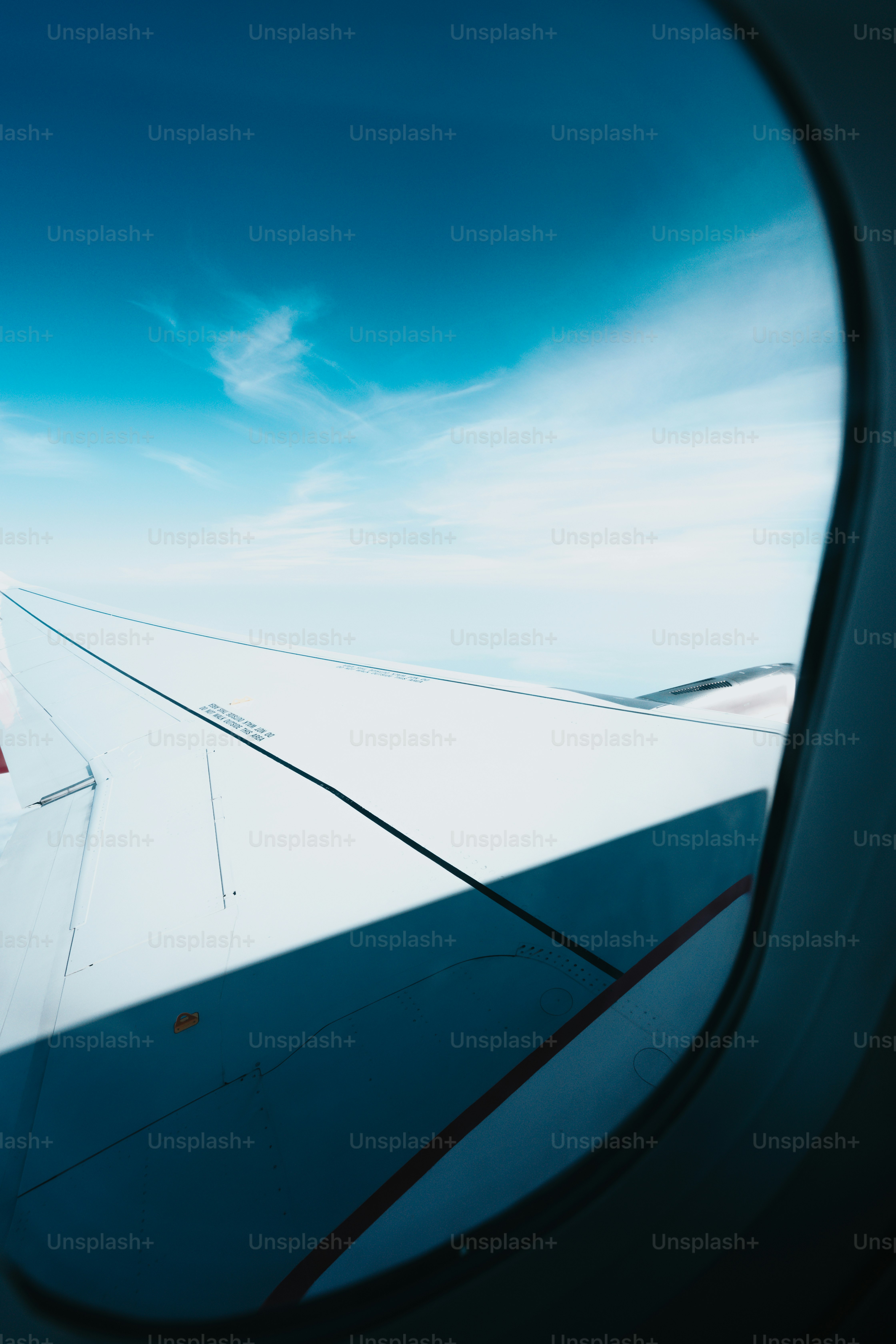 The wing of an airplane as seen from the window photo – Plane wing ...