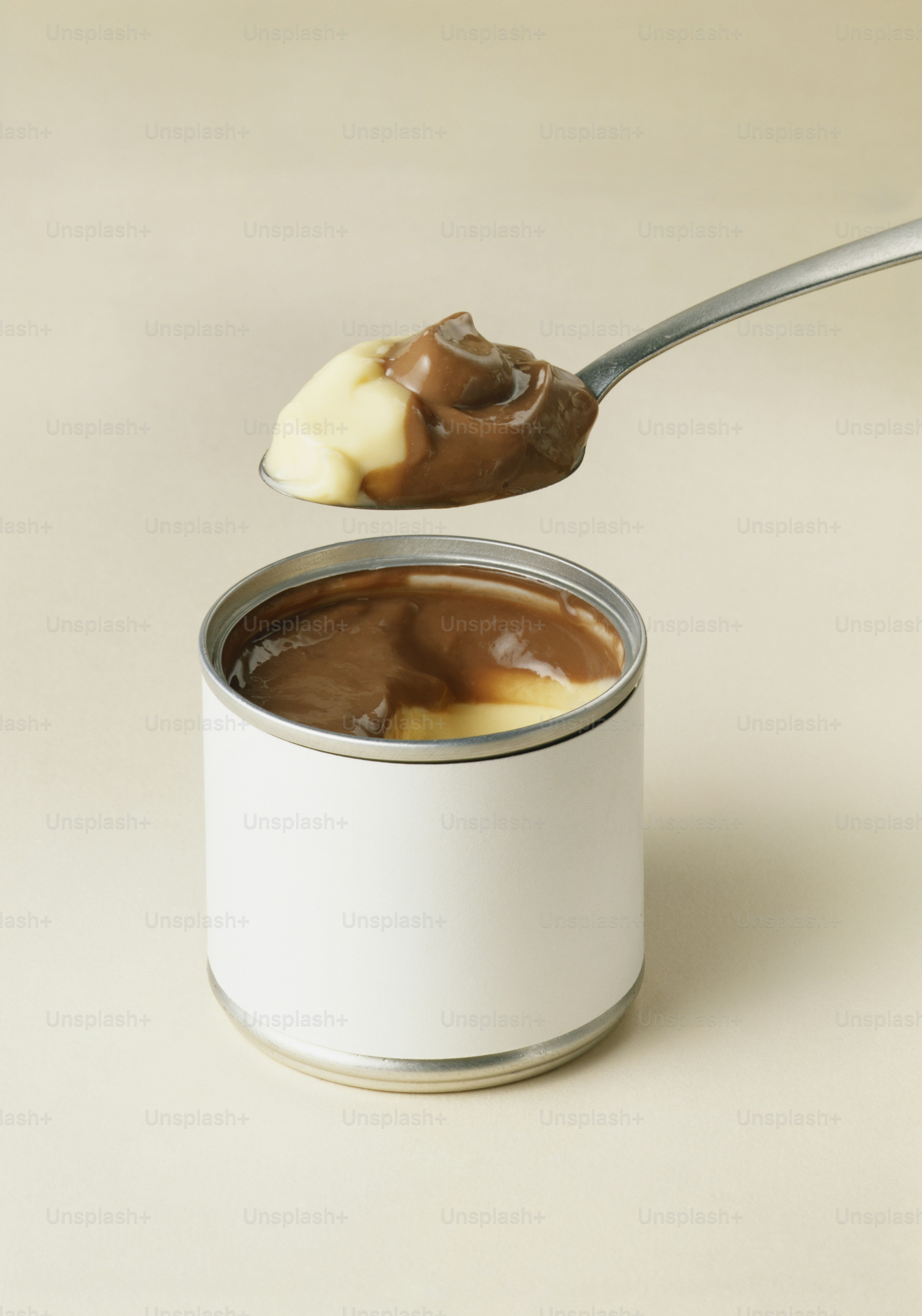 A spoon full of chocolate pudding with a bite taken out of it photo ...