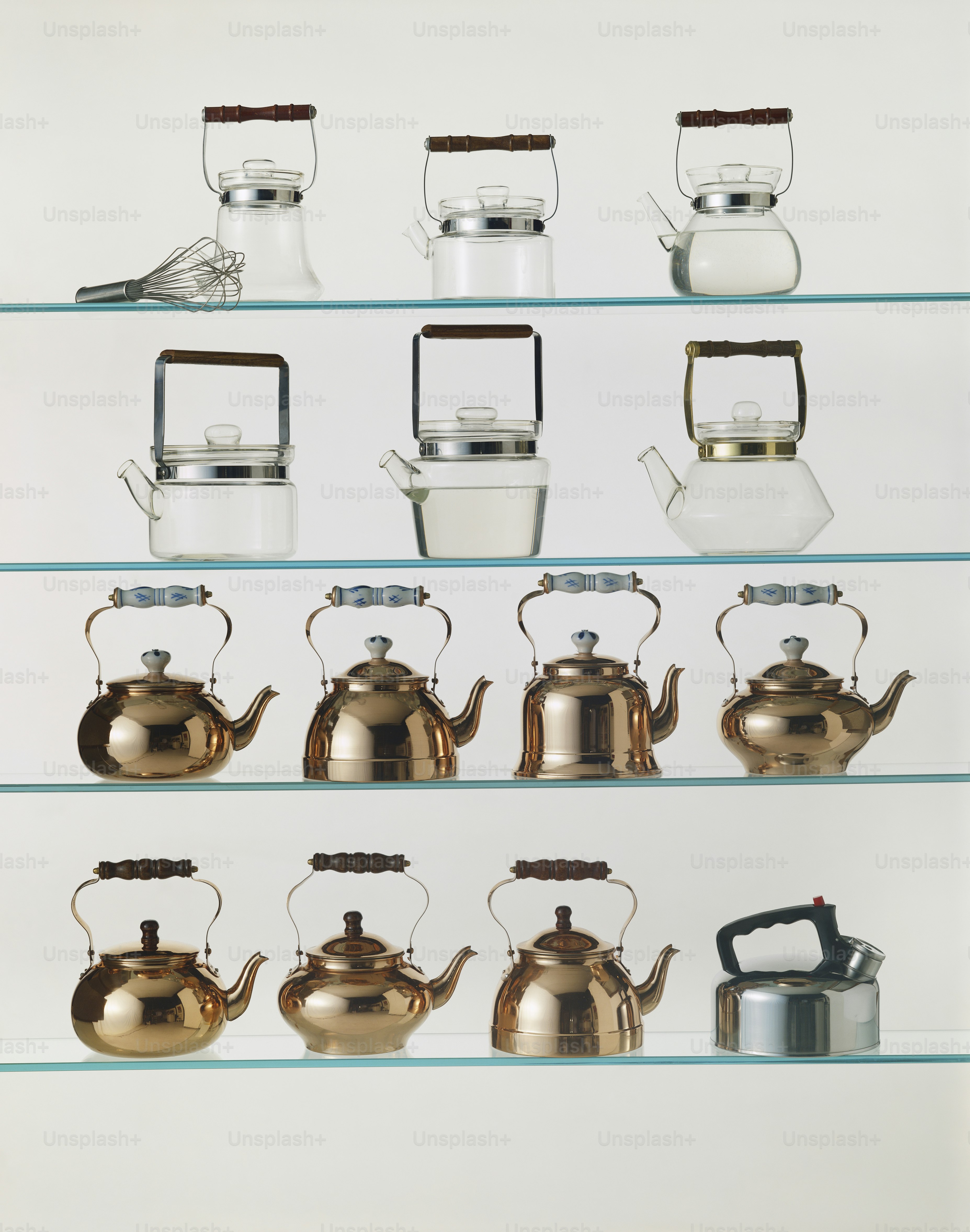 A shelf filled with lots of different types of kettles photo – No ...