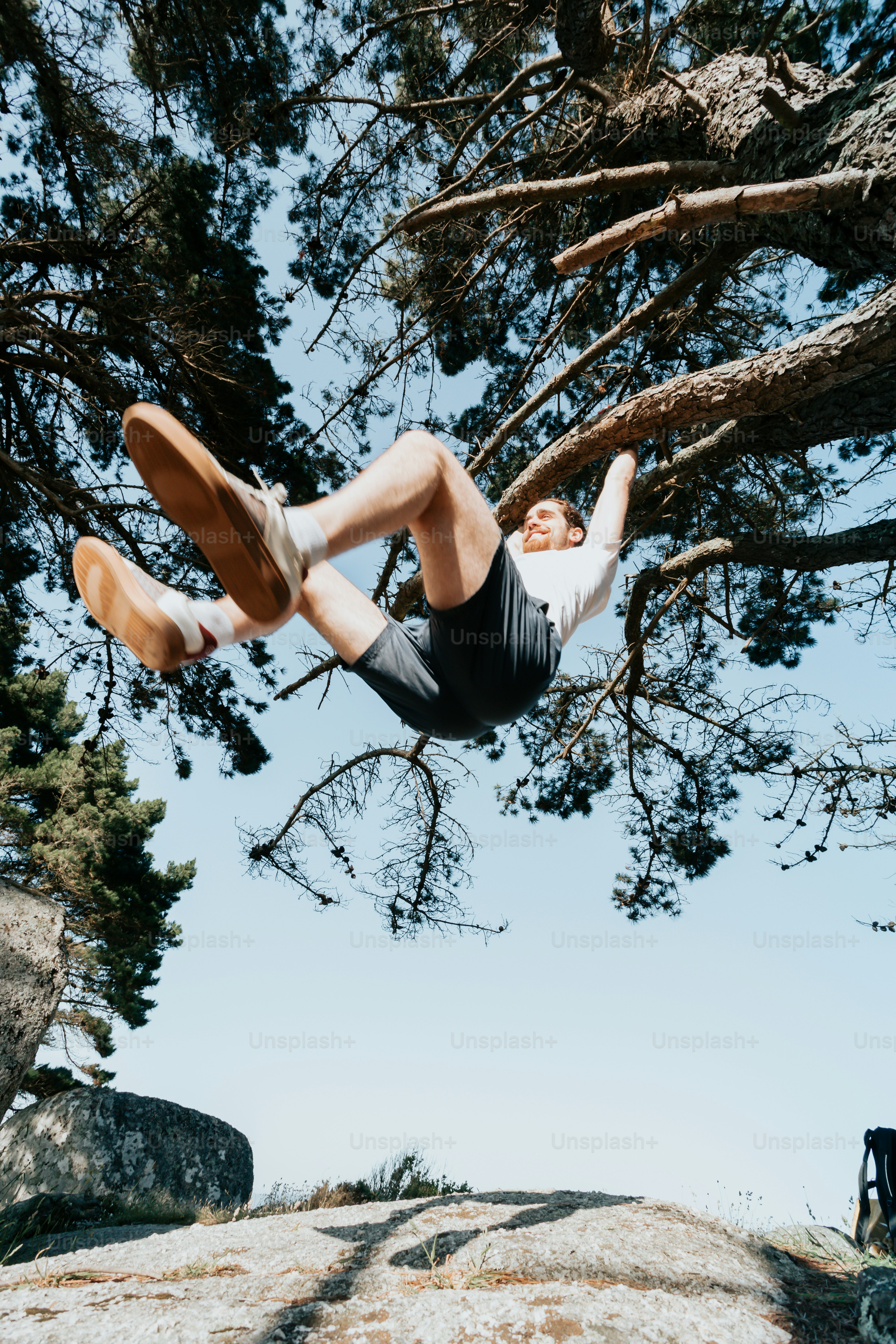 A man flying through the air while riding a skateboard photo – Joy ...