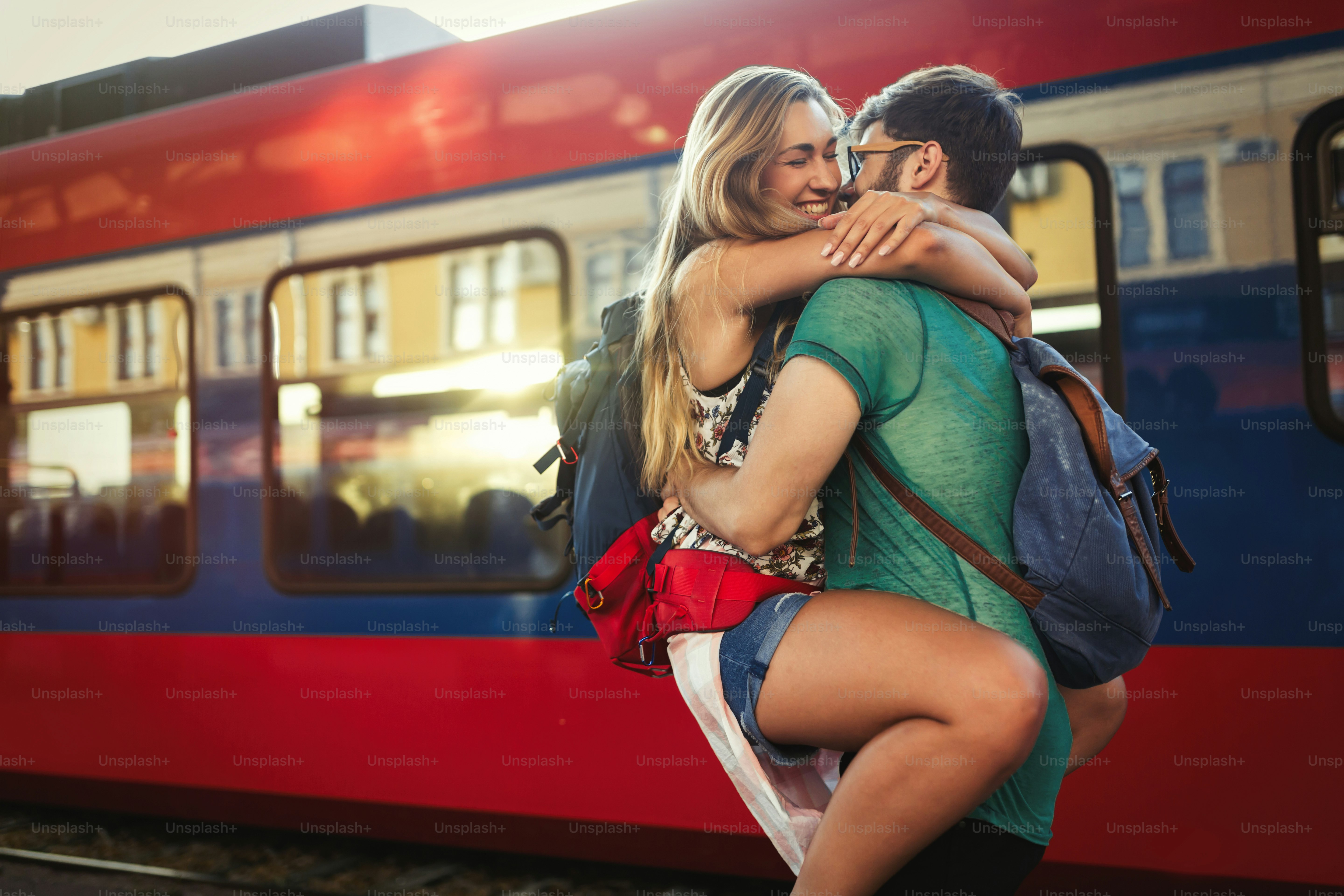Beautiful couple reunion /separation at train station photo – Vacations Image on Unsplash