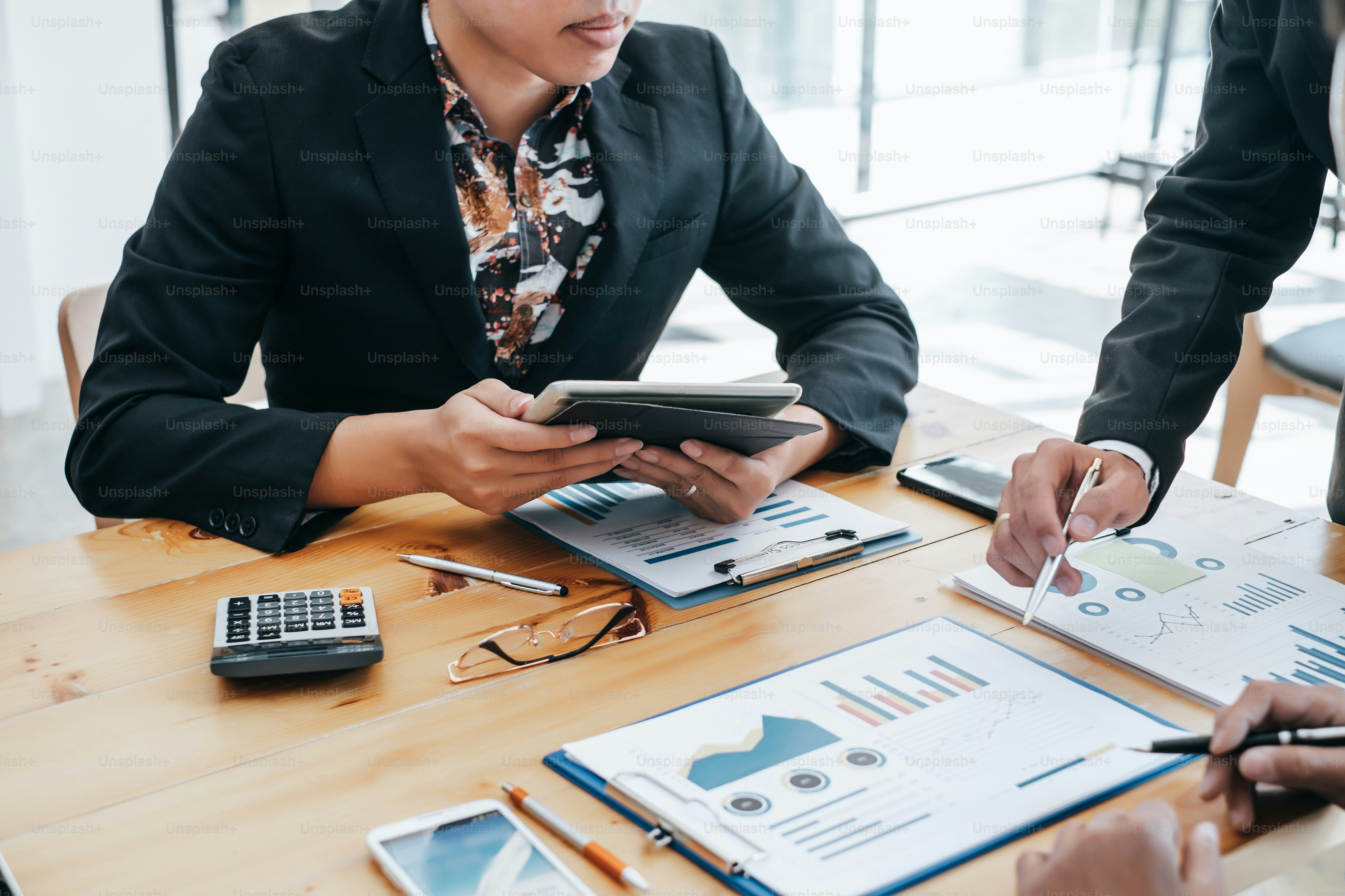 Business people meeting together about investment and the discussion ...