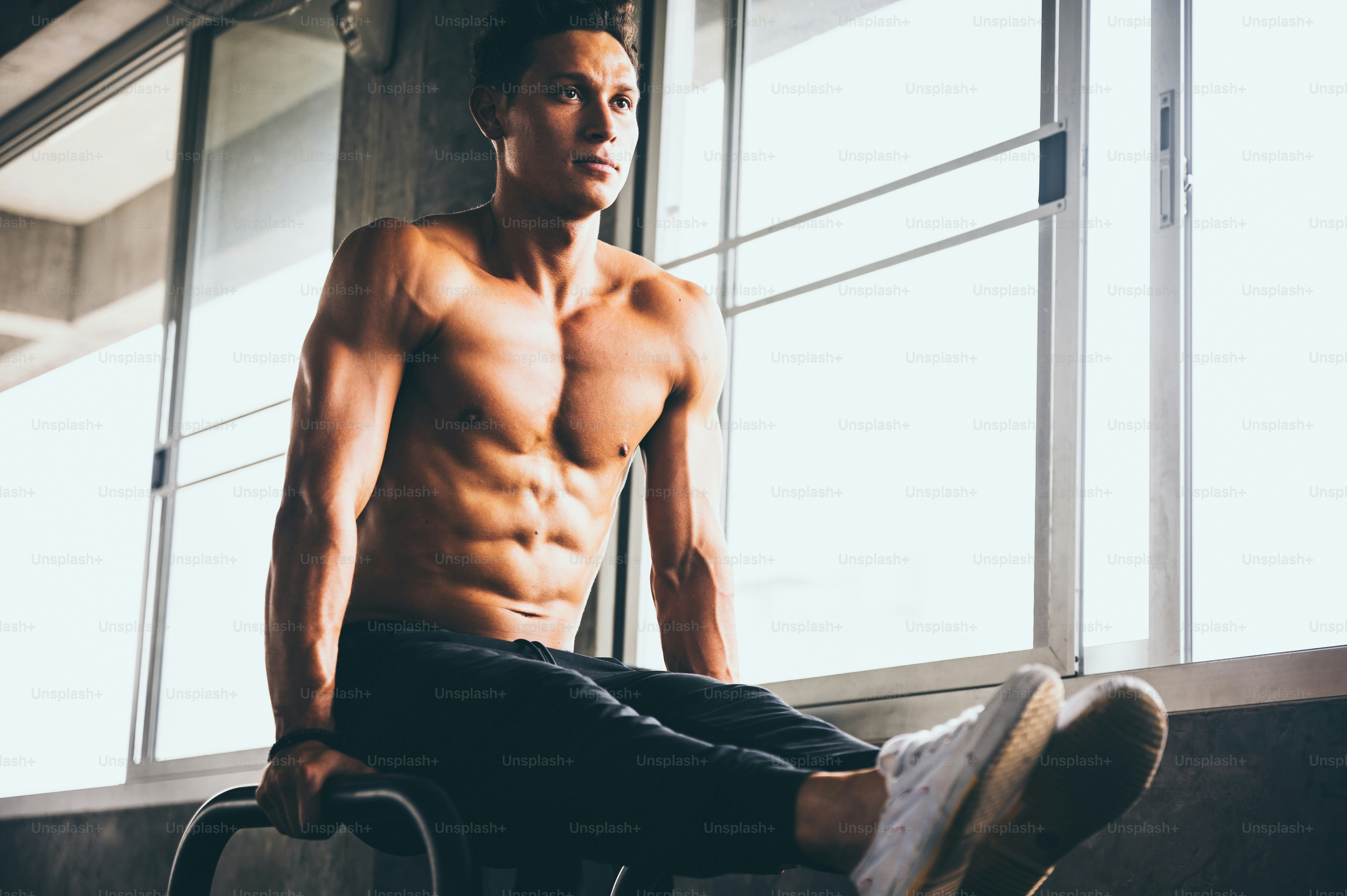 Strong man exercising in the sport gym photo – Bodybuilding Image on ...