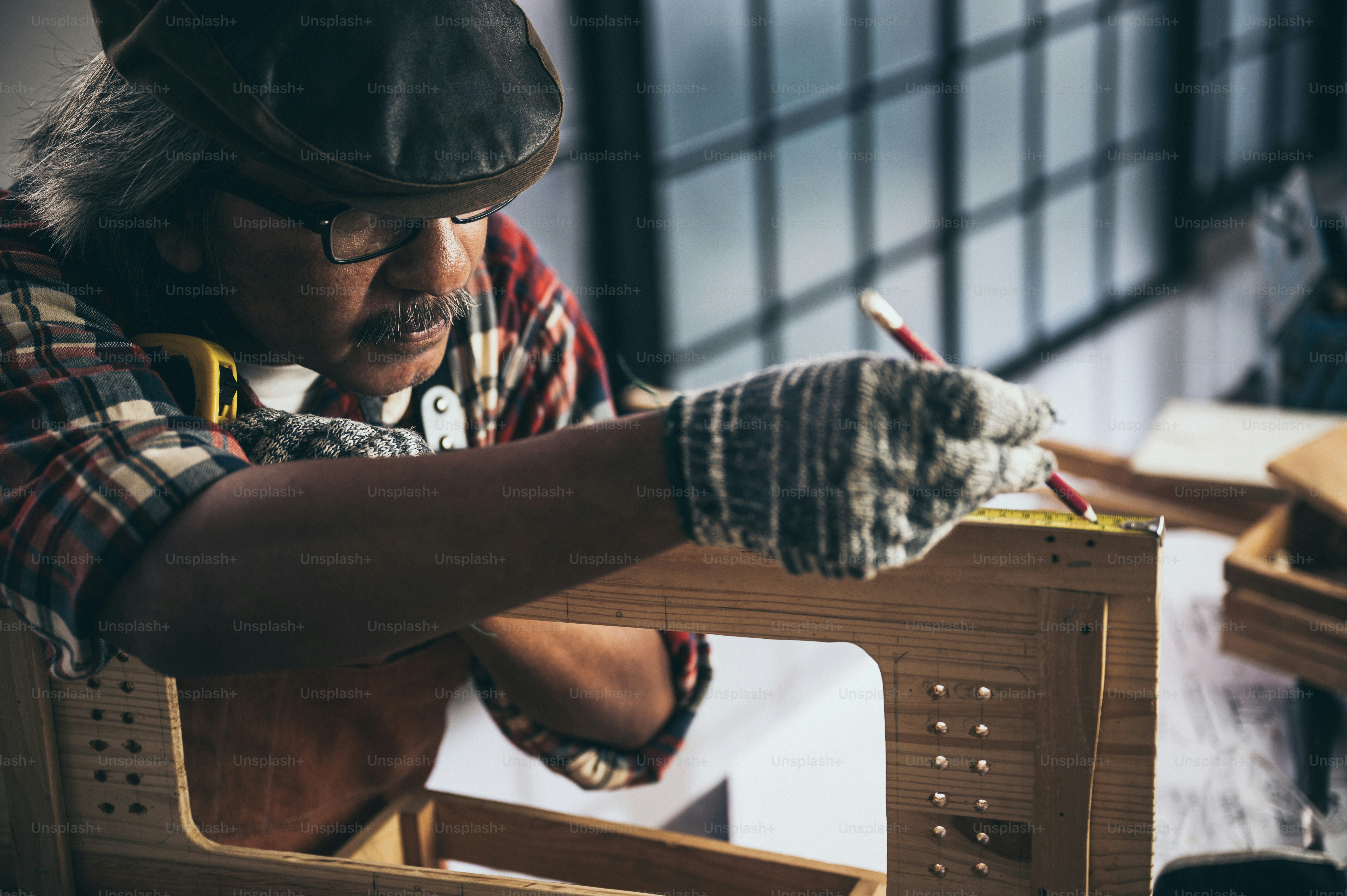 A carpenter is designing and working on hand-made wood. photo – Sawdust ...
