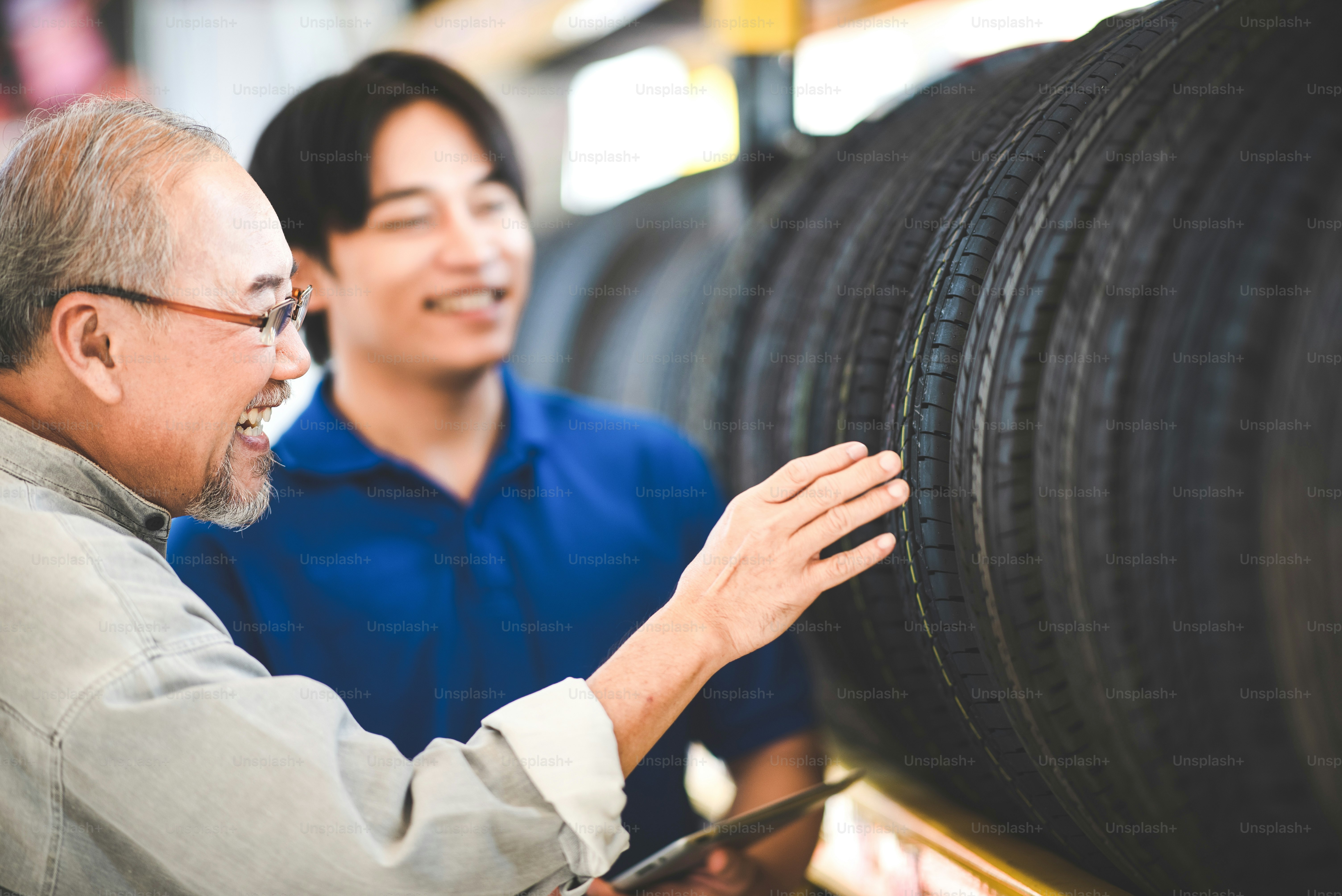 Man customer client choosing and buying a retail tire at automobile ...
