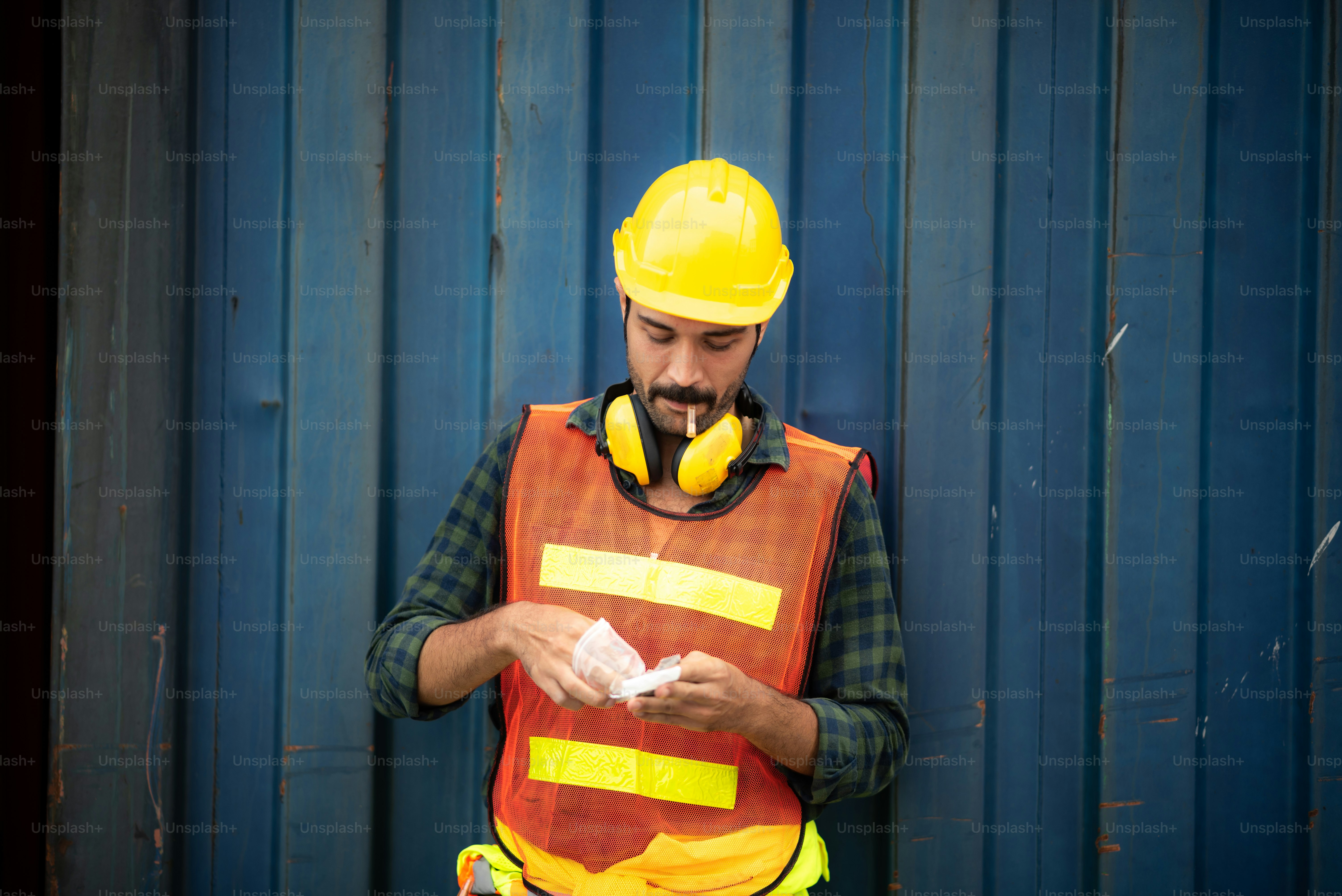 An employee foreman men worker smoking cigarette tobacco nicotine whlie ...