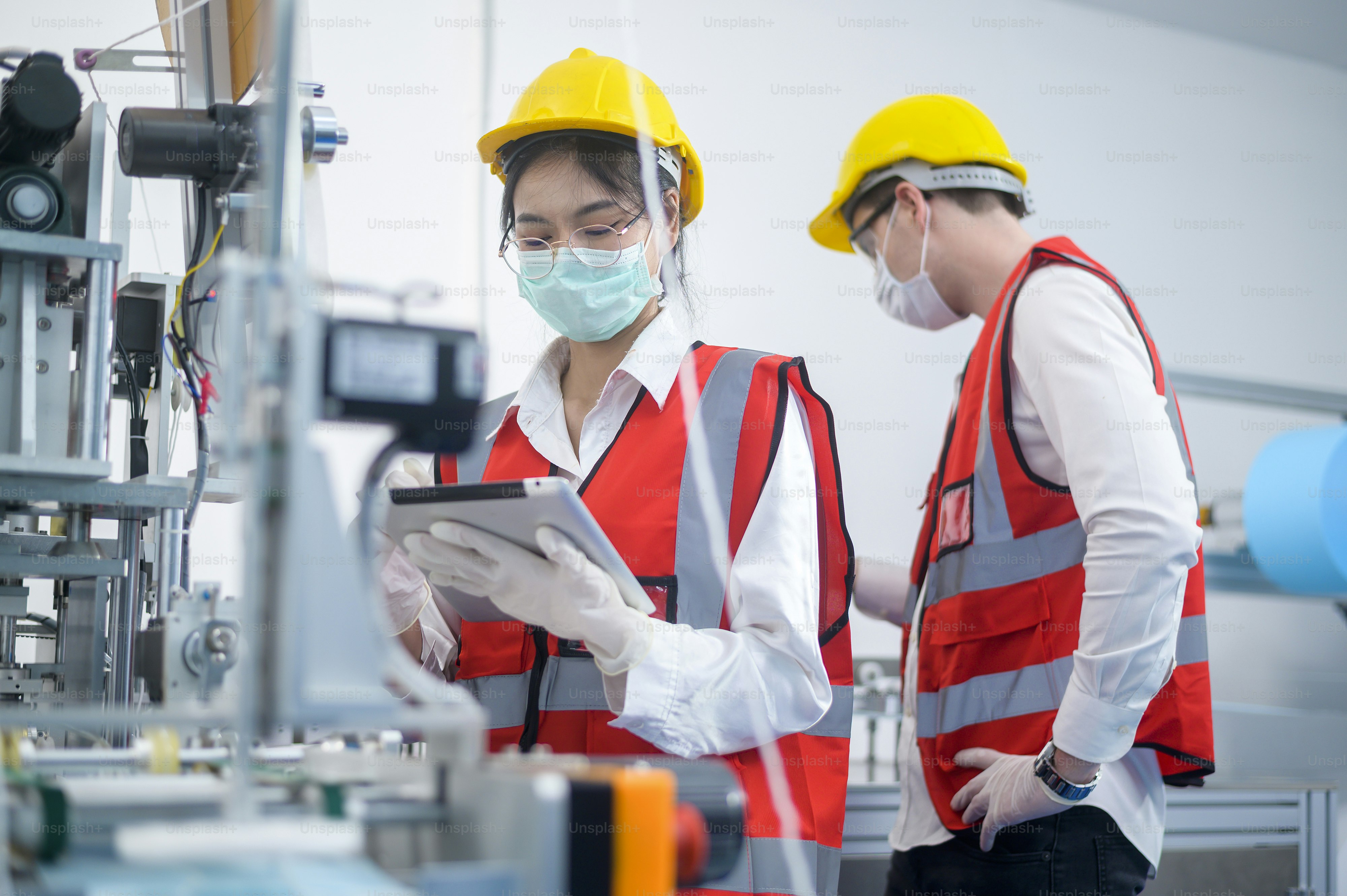 Quality control (QC) engineer monitoring and checking machine system in ...