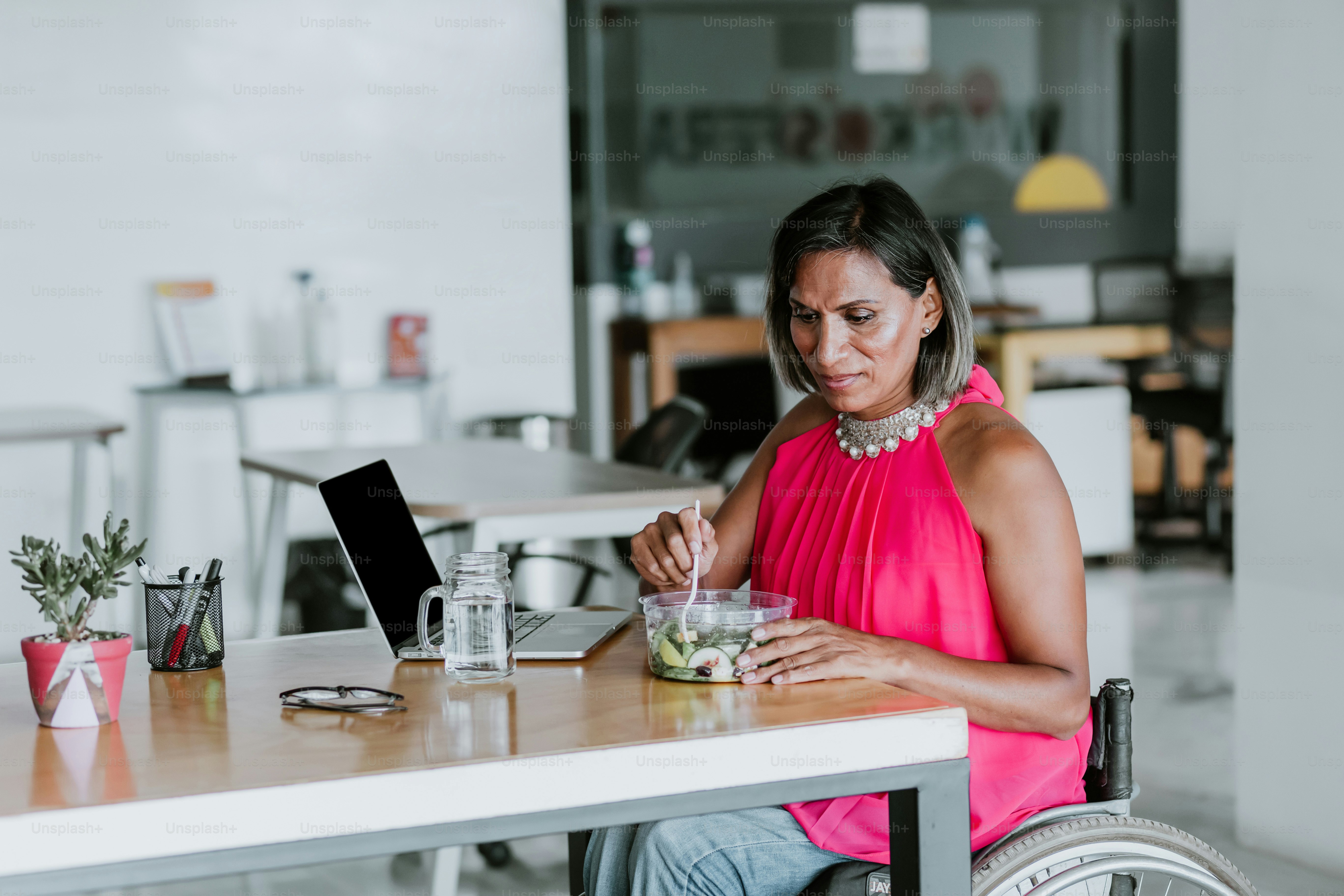 Transgender latin woman working with computer at the office in Mexico ...
