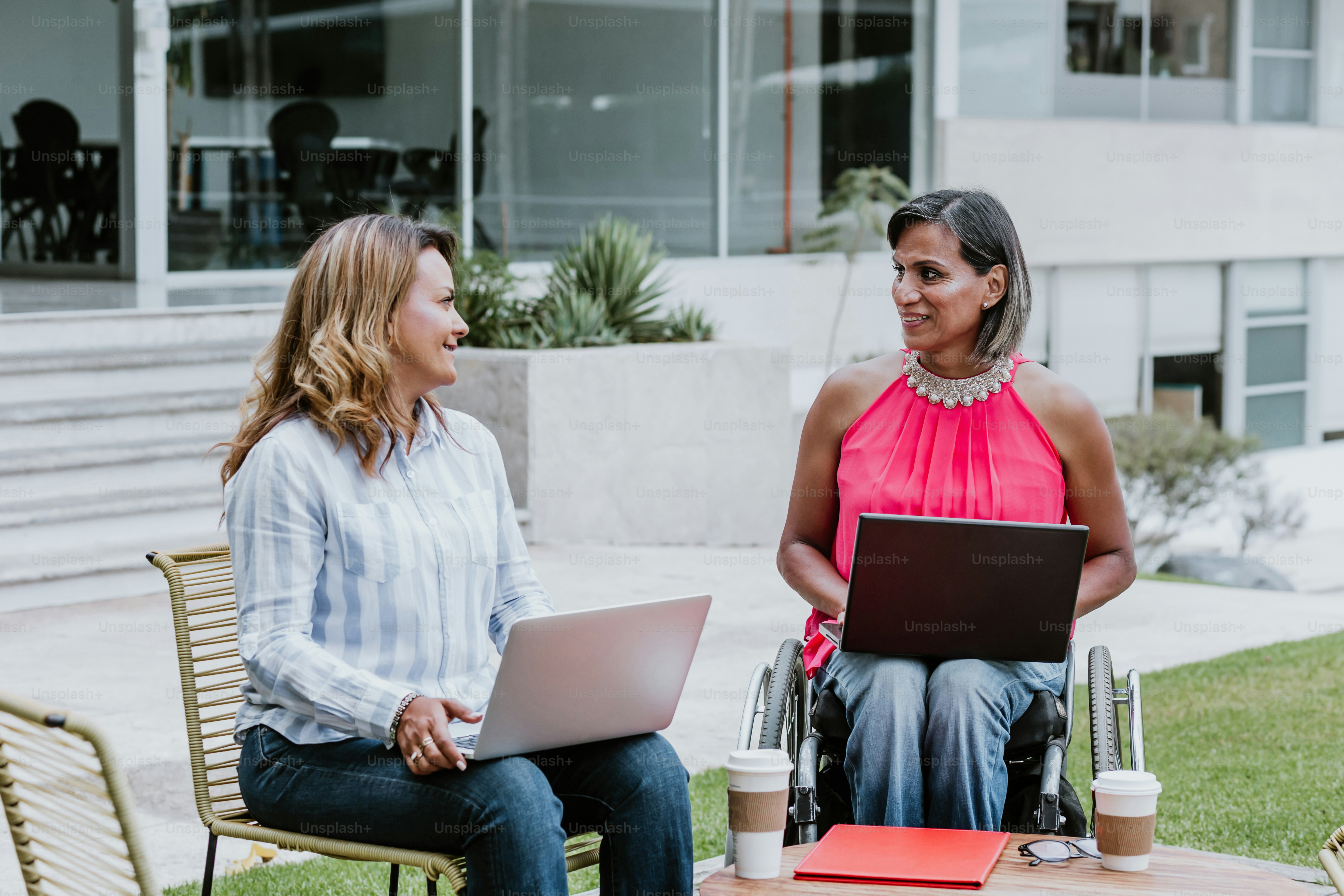 Transgender latin woman working with computer at the office in Mexico ...