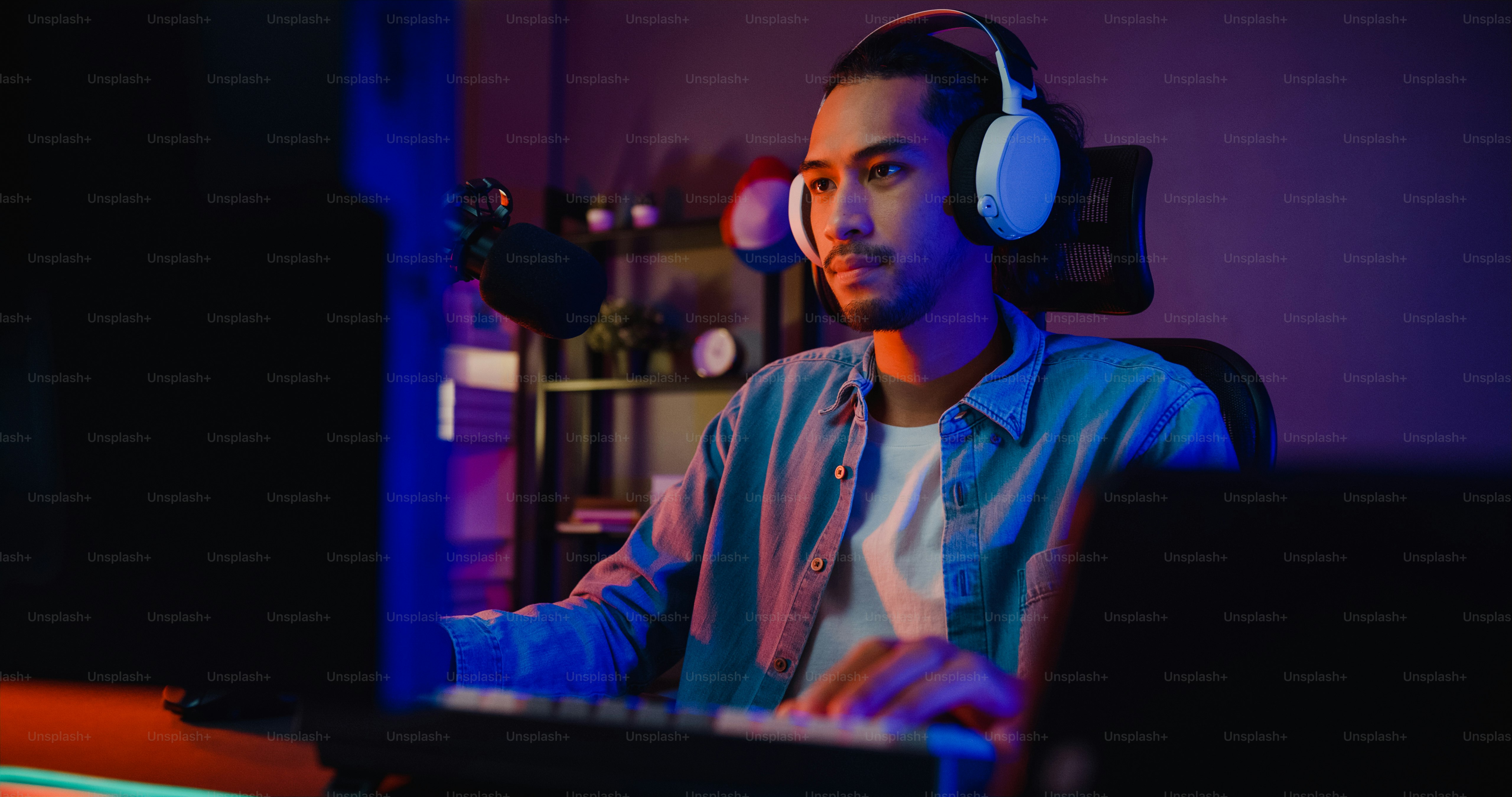 Happy asia guy gamer wear headphone participation play video game ...