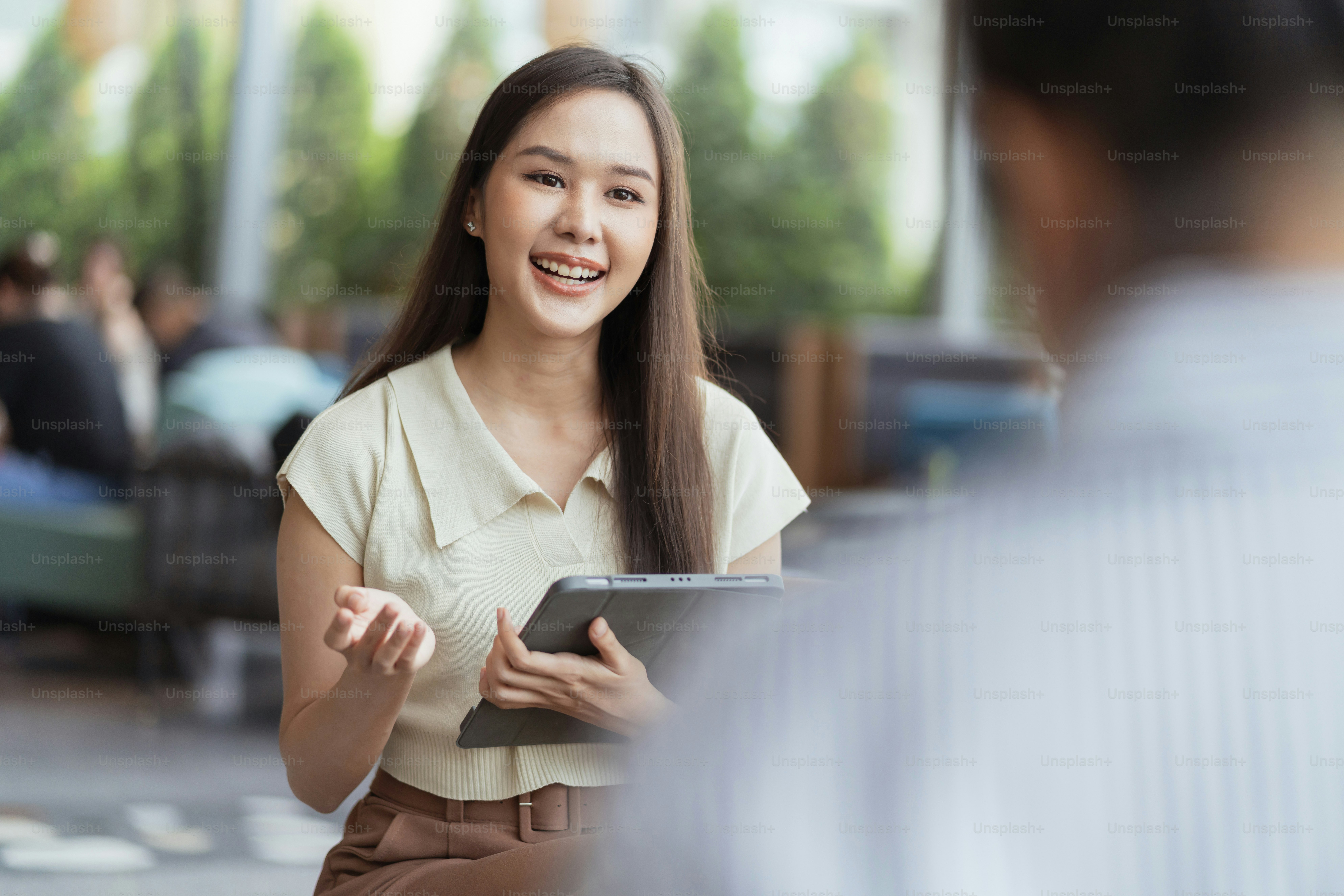 Asian female creative agency digital nomad working anywhere discuss with friend about her ...